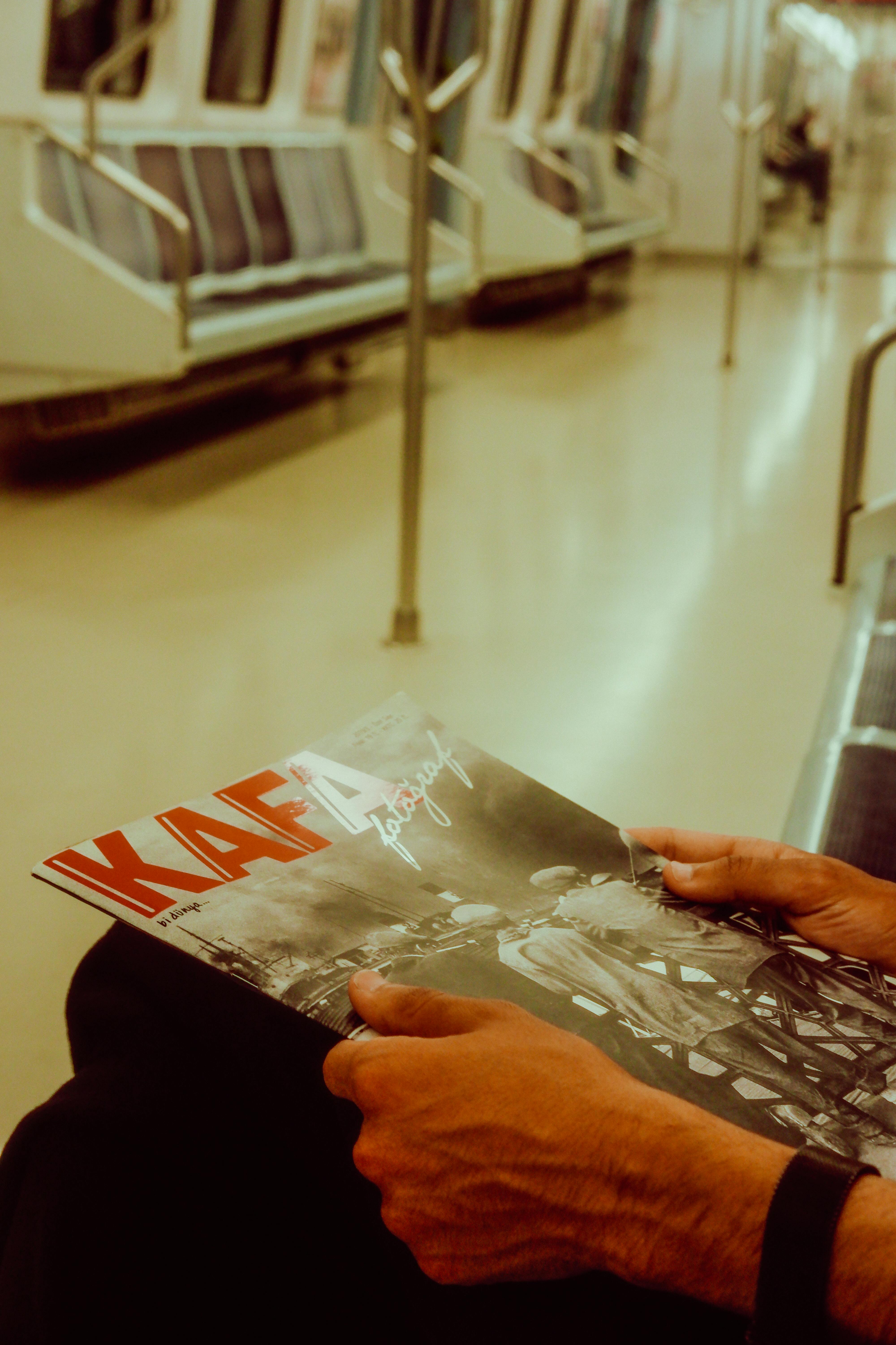 Hands Holding Magazine · Free Stock Photo