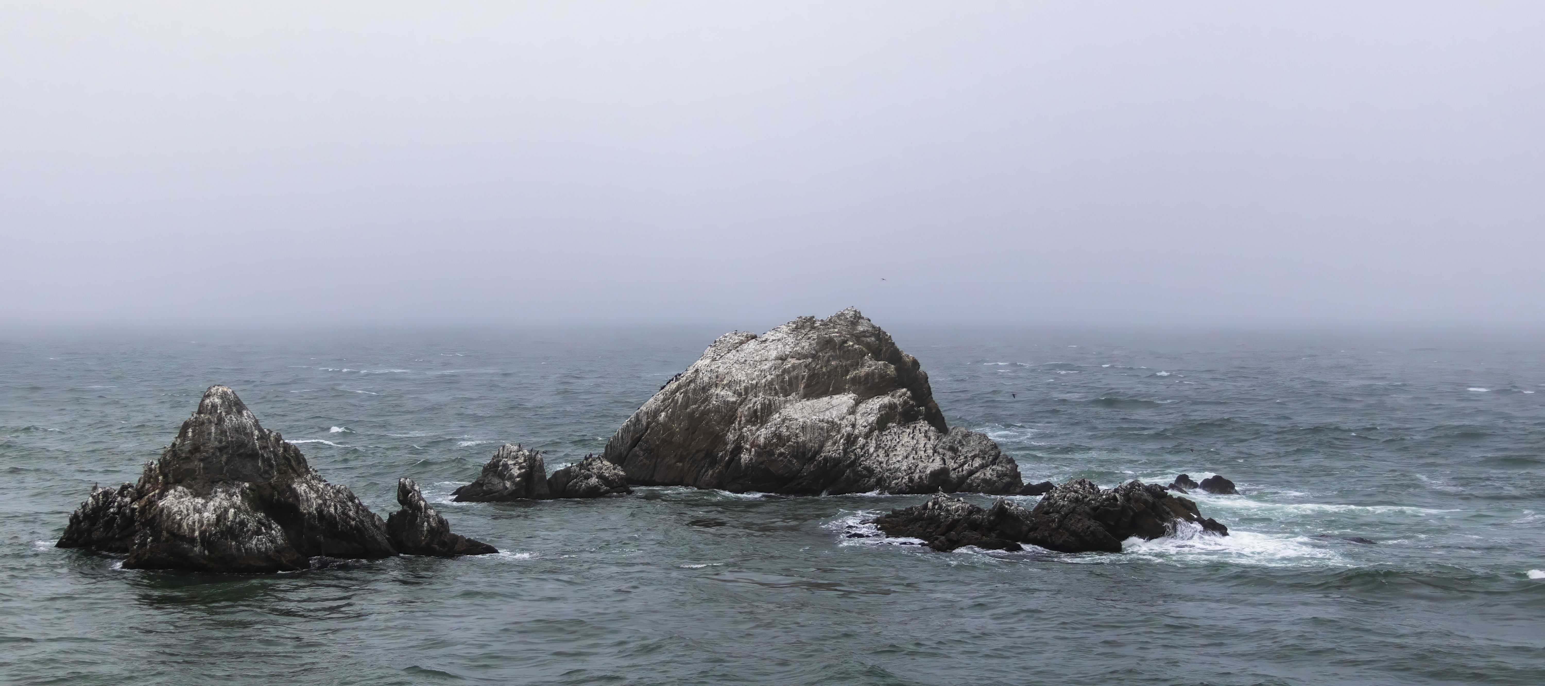 Spiky Rock in Sea · Free Stock Photo
