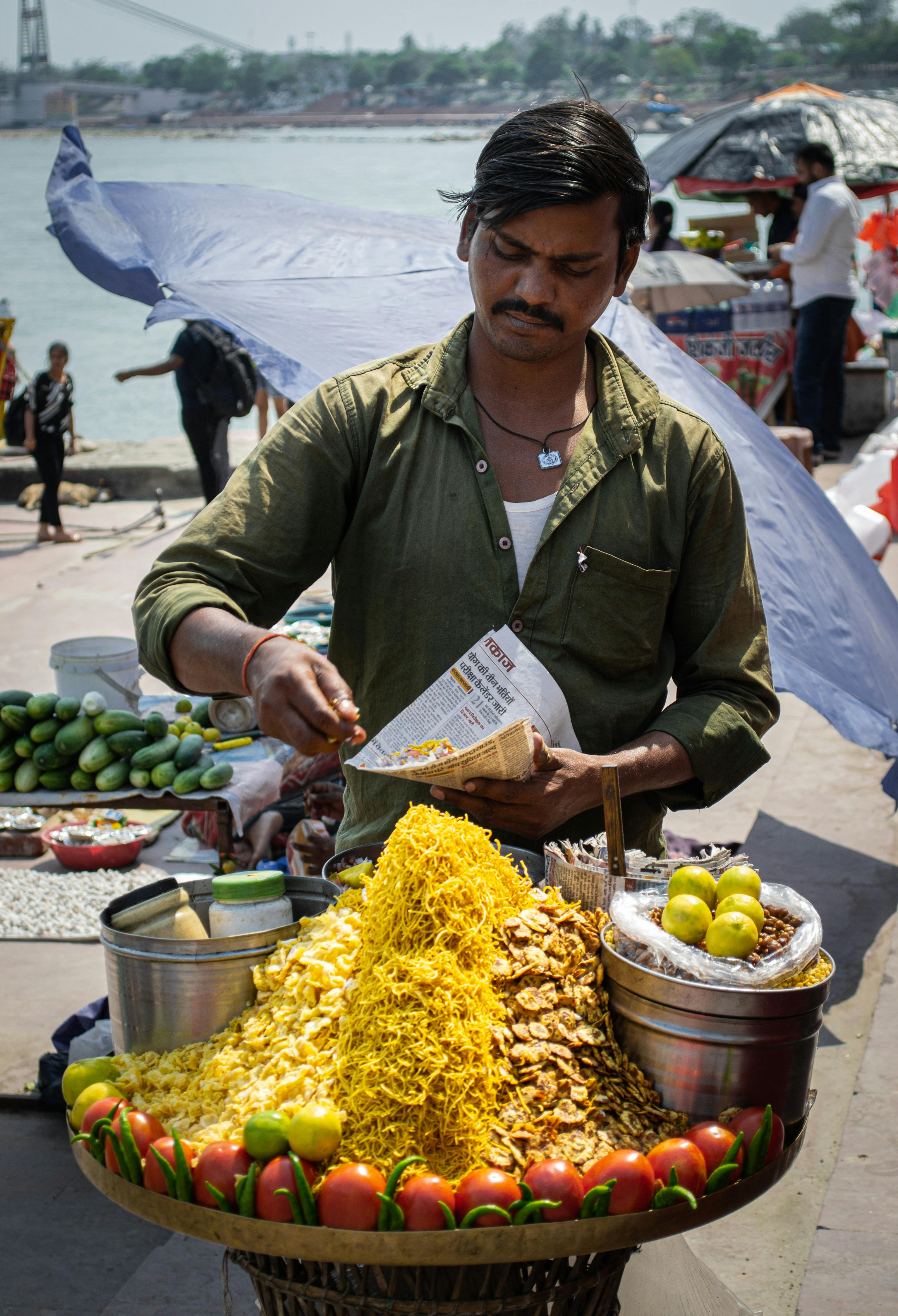 Man at Food Stand in Town · Free Stock Photo