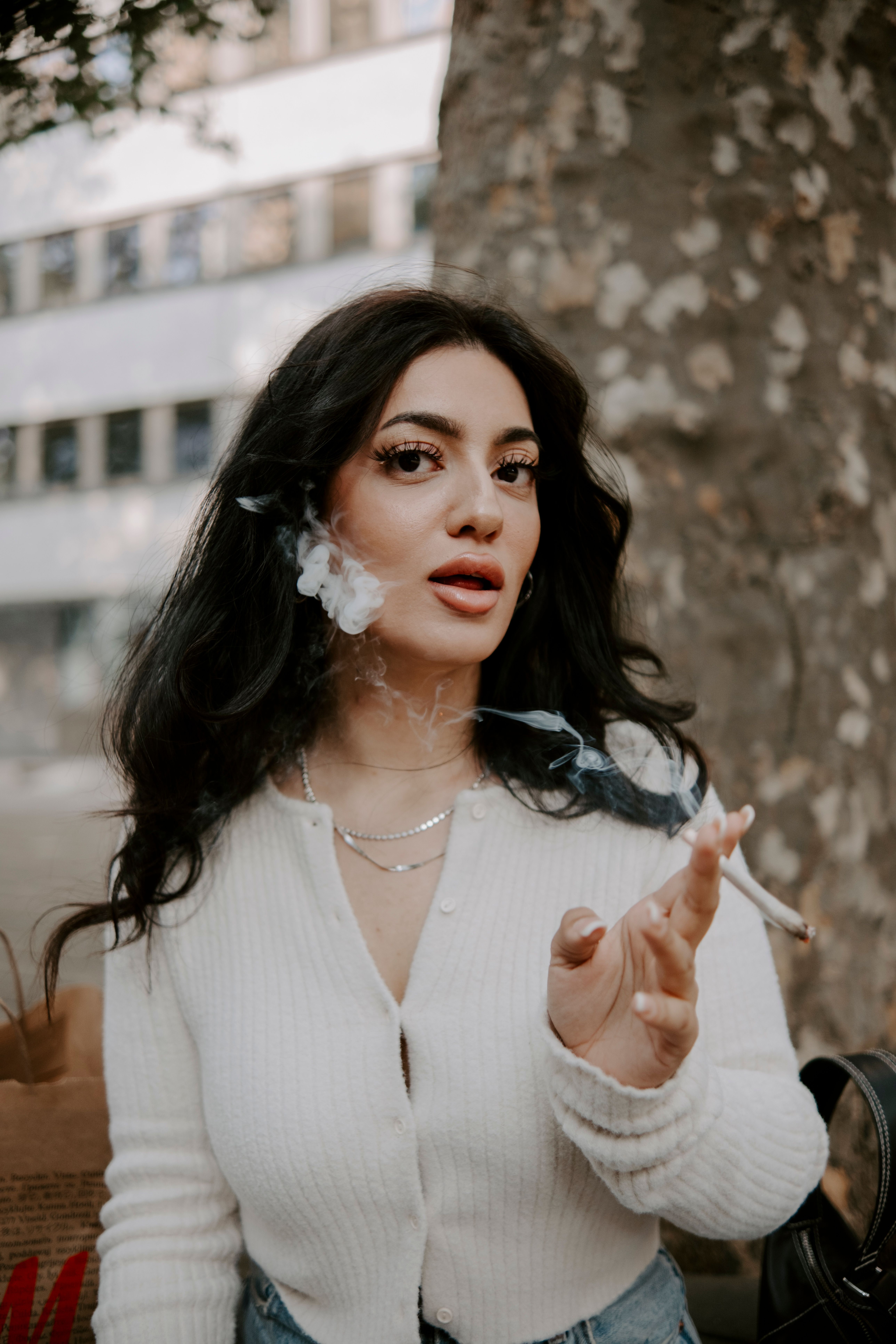 Young Woman Smoking Outside in City · Free Stock Photo