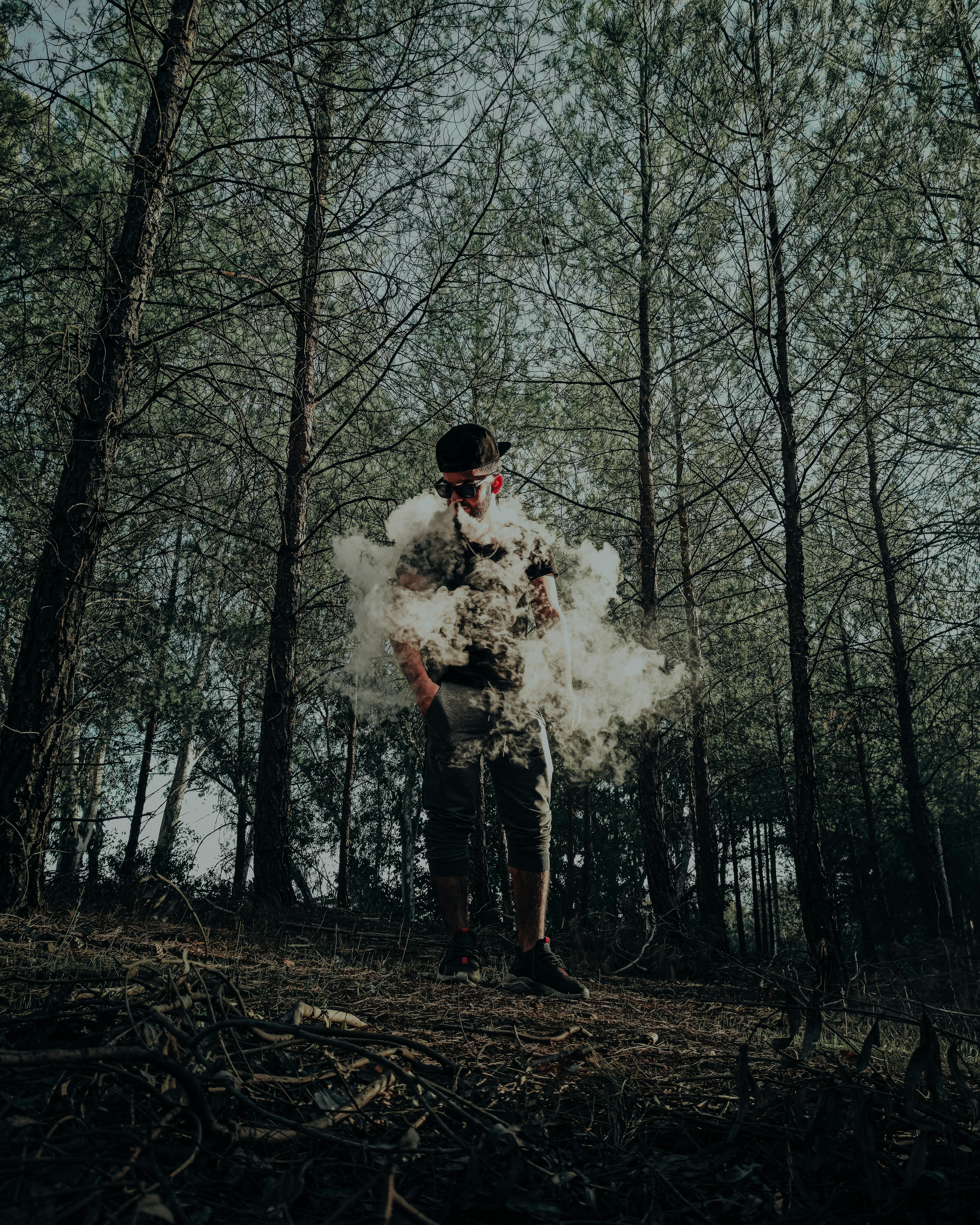 A Man Smoking in the Forest · Free Stock Photo