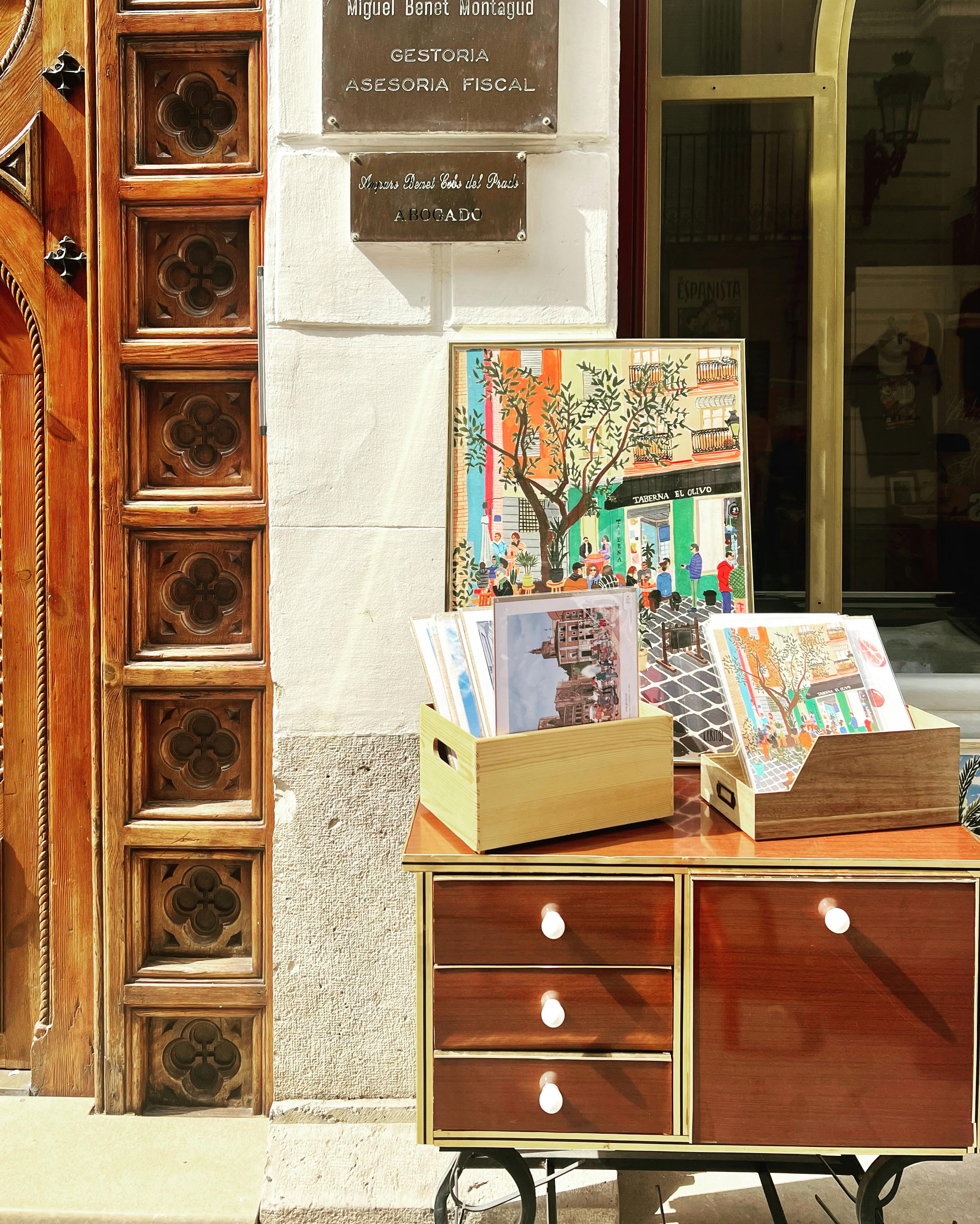 Paintings in Boxes on Cabinet on Sidewalk · Free Stock Photo