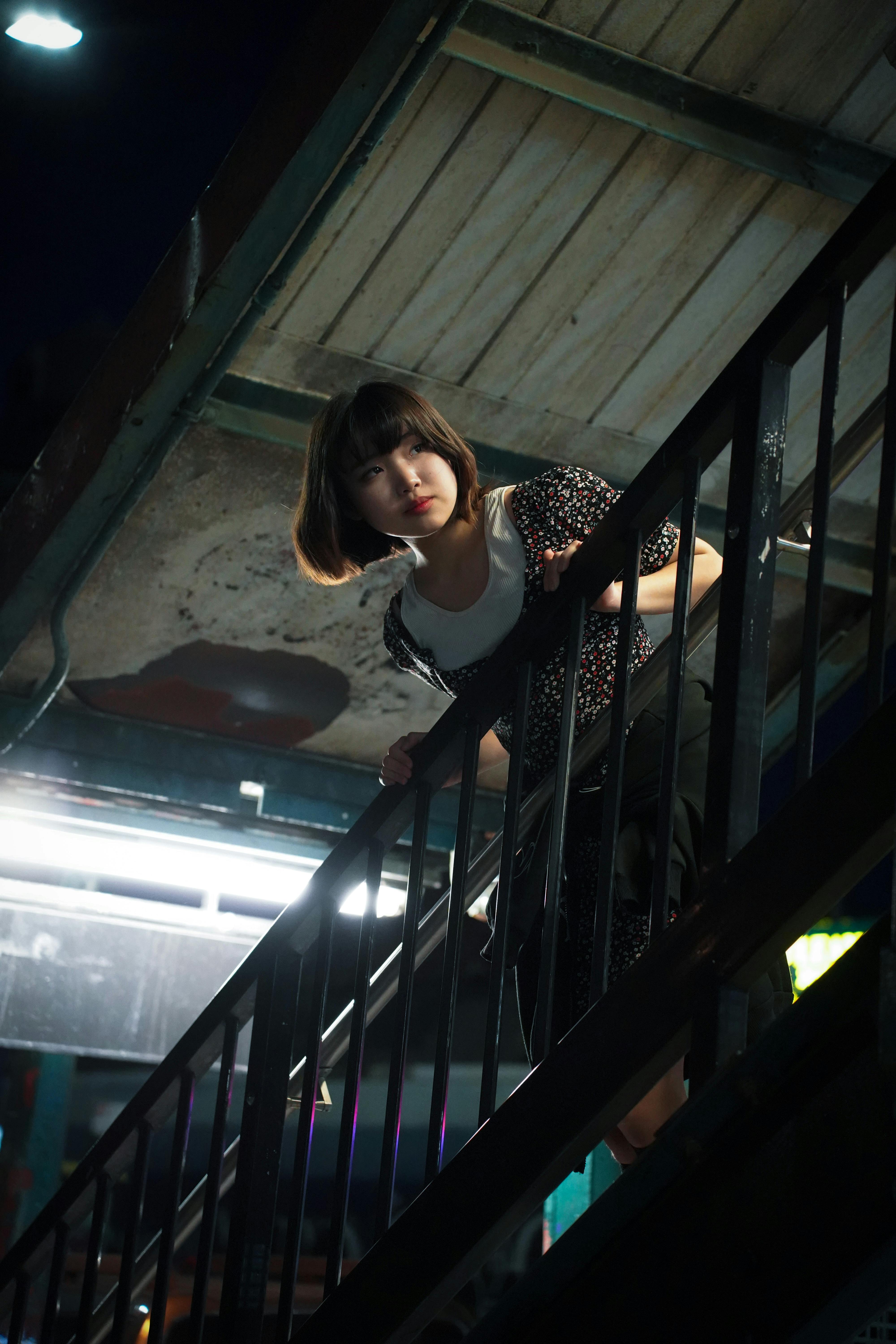 Woman Bending over Handrail · Free Stock Photo