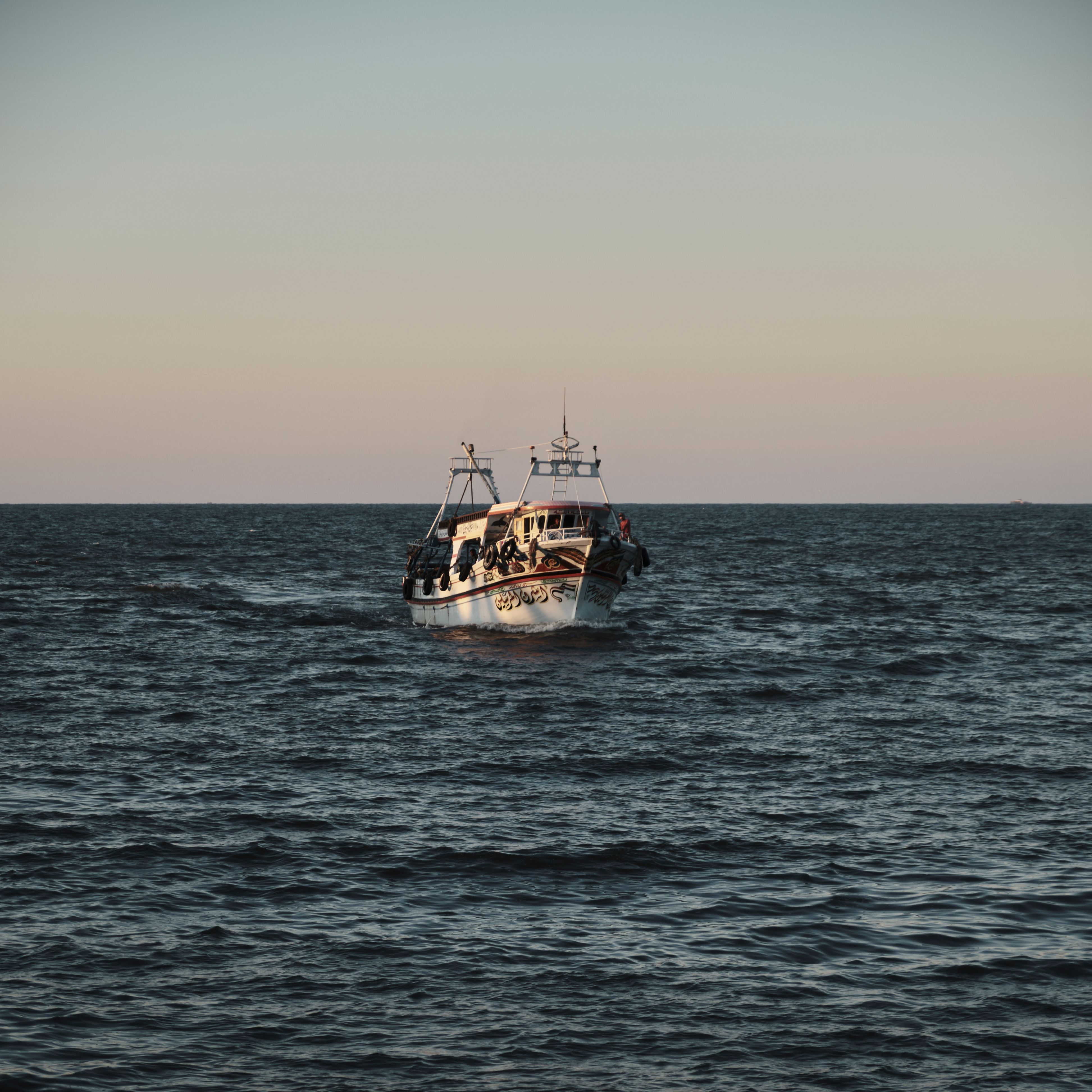 Open Sea behind Sailing Vessel Railing · Free Stock Photo