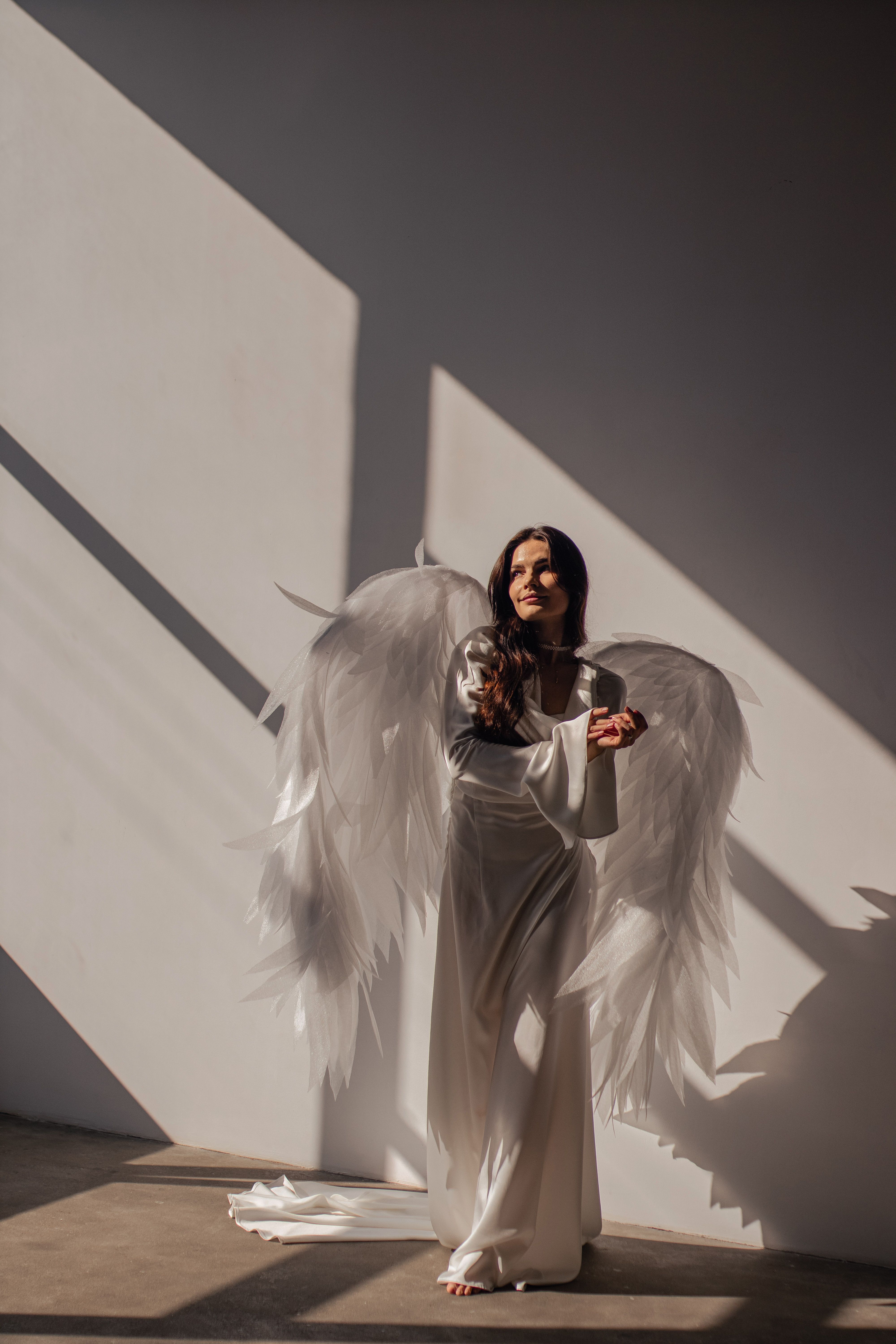 Standing Barefoot Woman in Angel Costume · Free Stock Photo