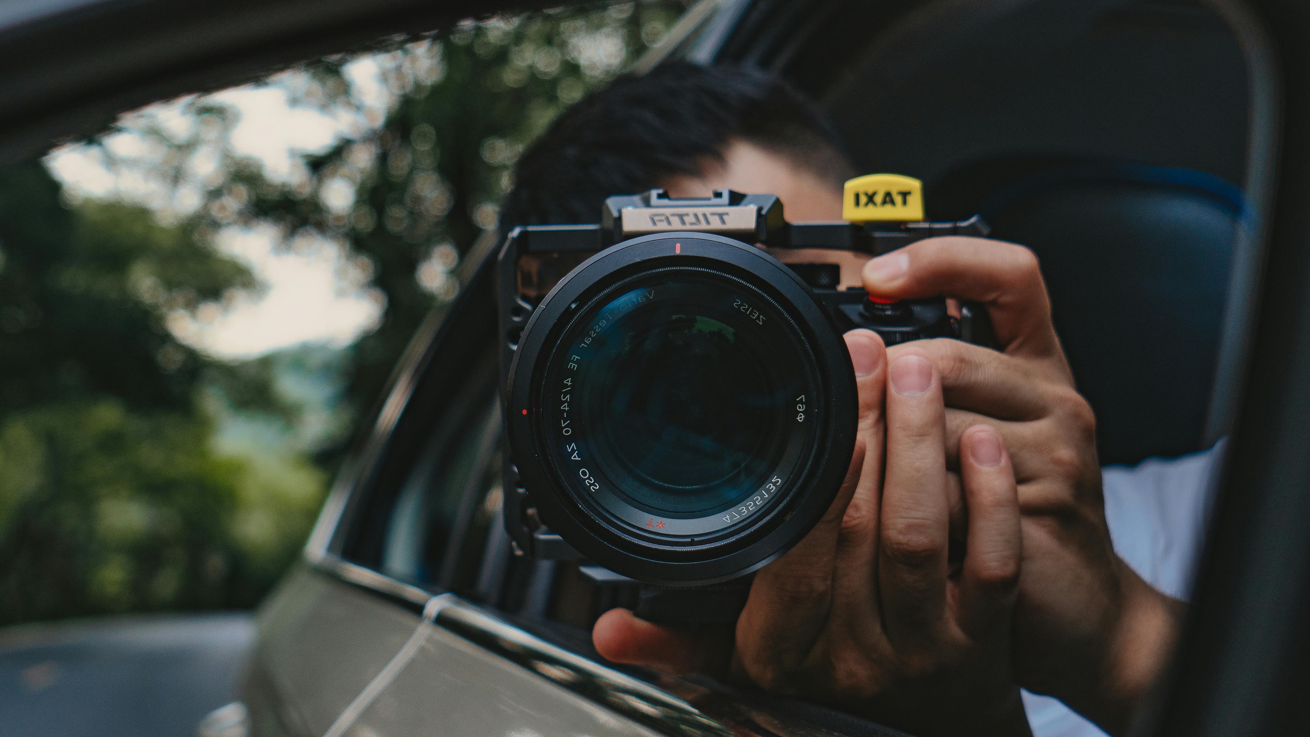 A Person Holding a Camera · Free Stock Photo