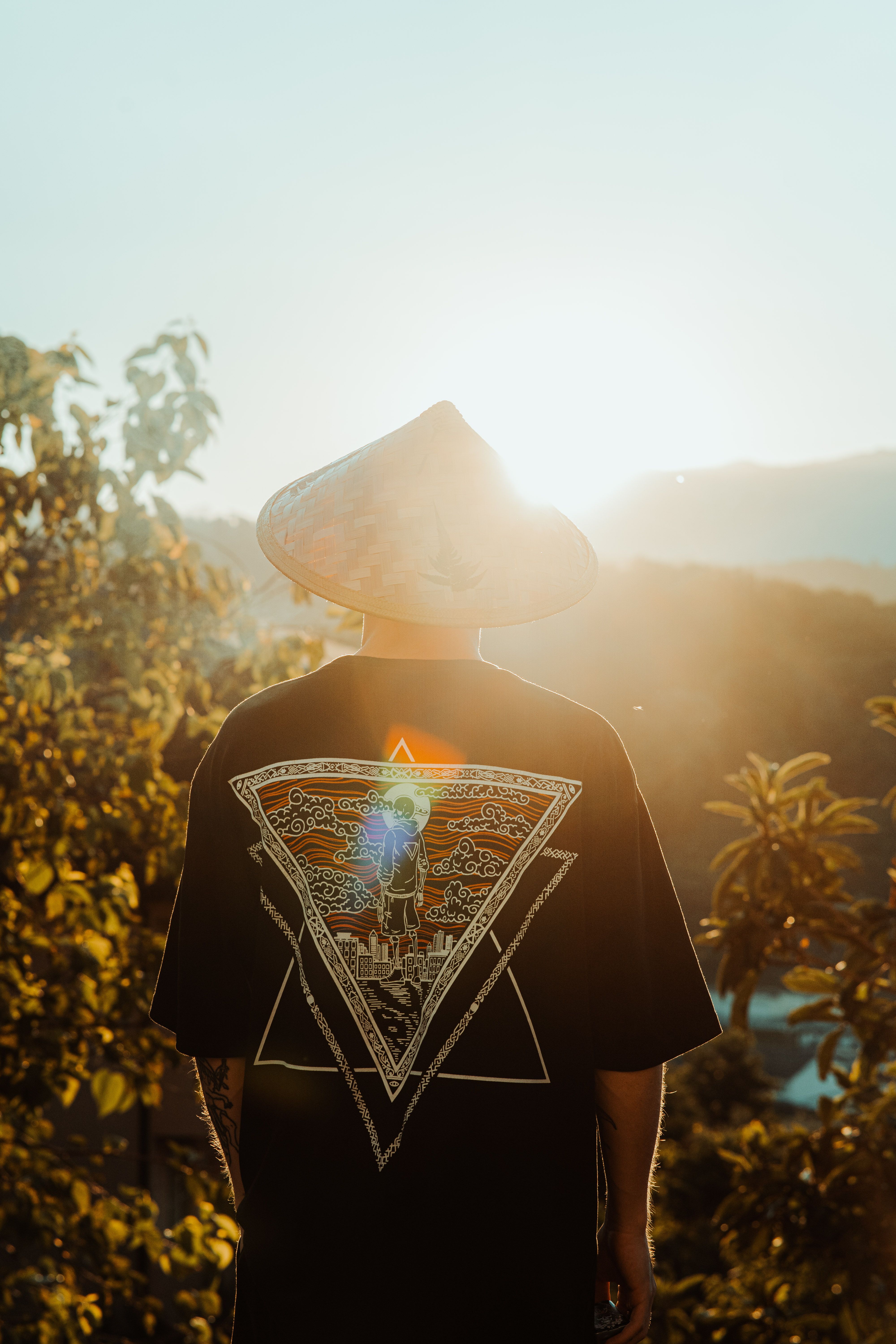 A Man Standing Outdoors at Sunset · Free Stock Photo