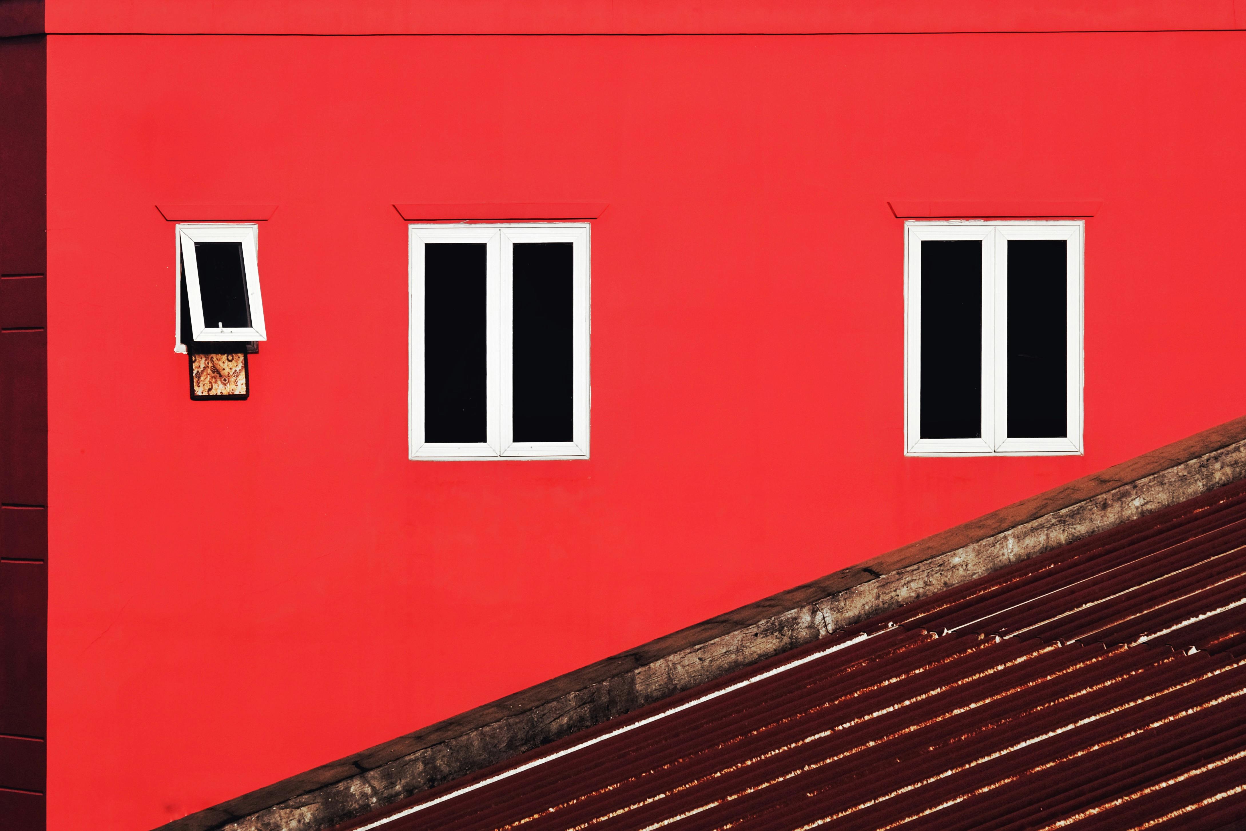 Sunlit Red Building Wall · Free Stock Photo