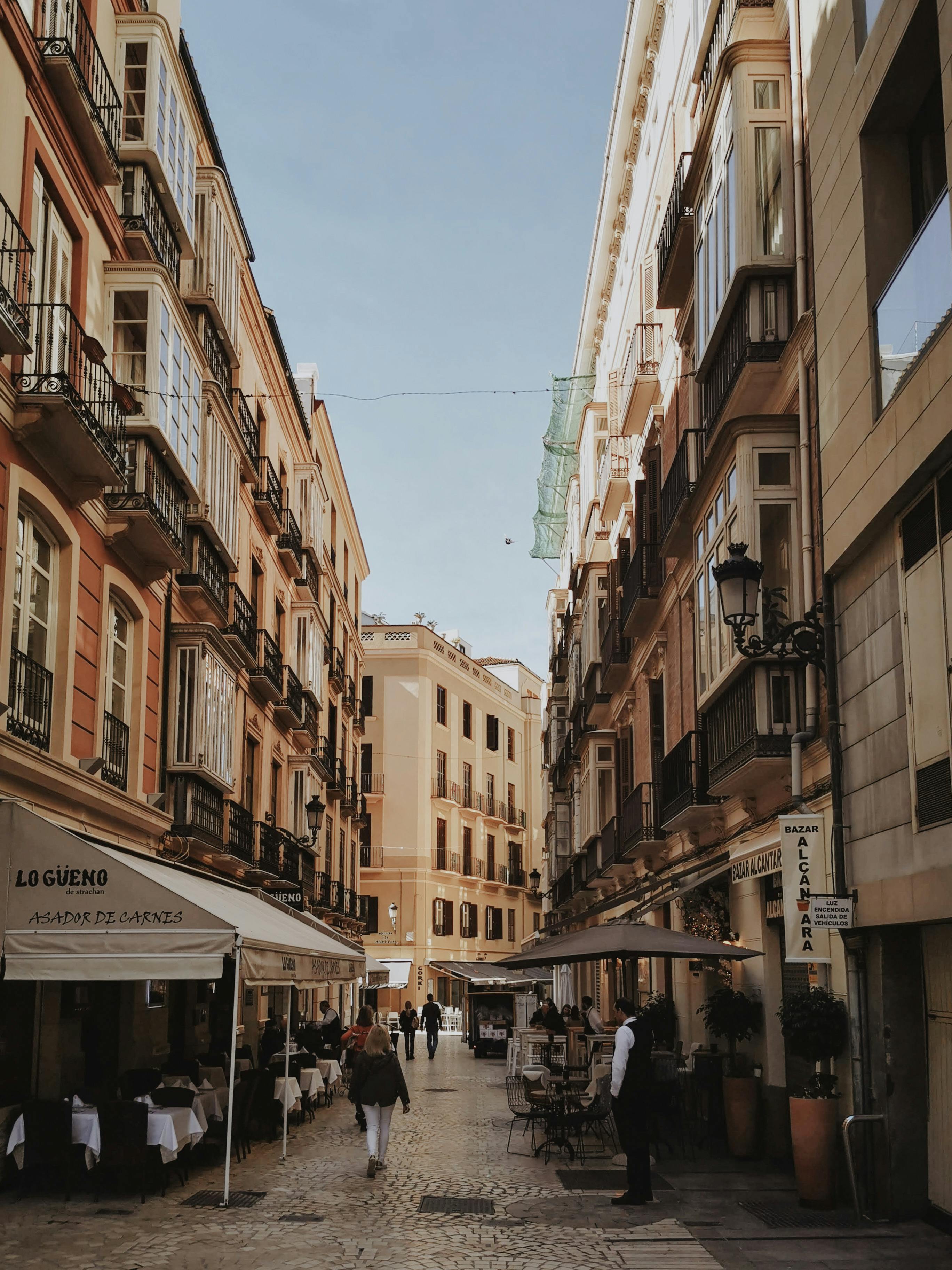 Narrow Street with Restaurants in Town · Free Stock Photo