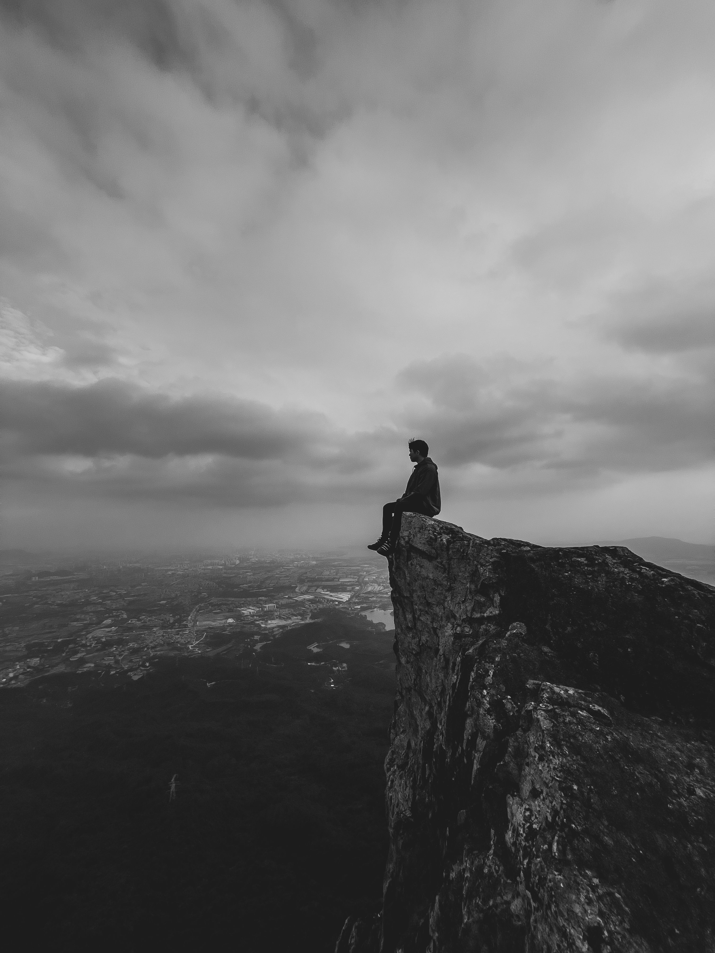 Man Sitting on Cliff · Free Stock Photo