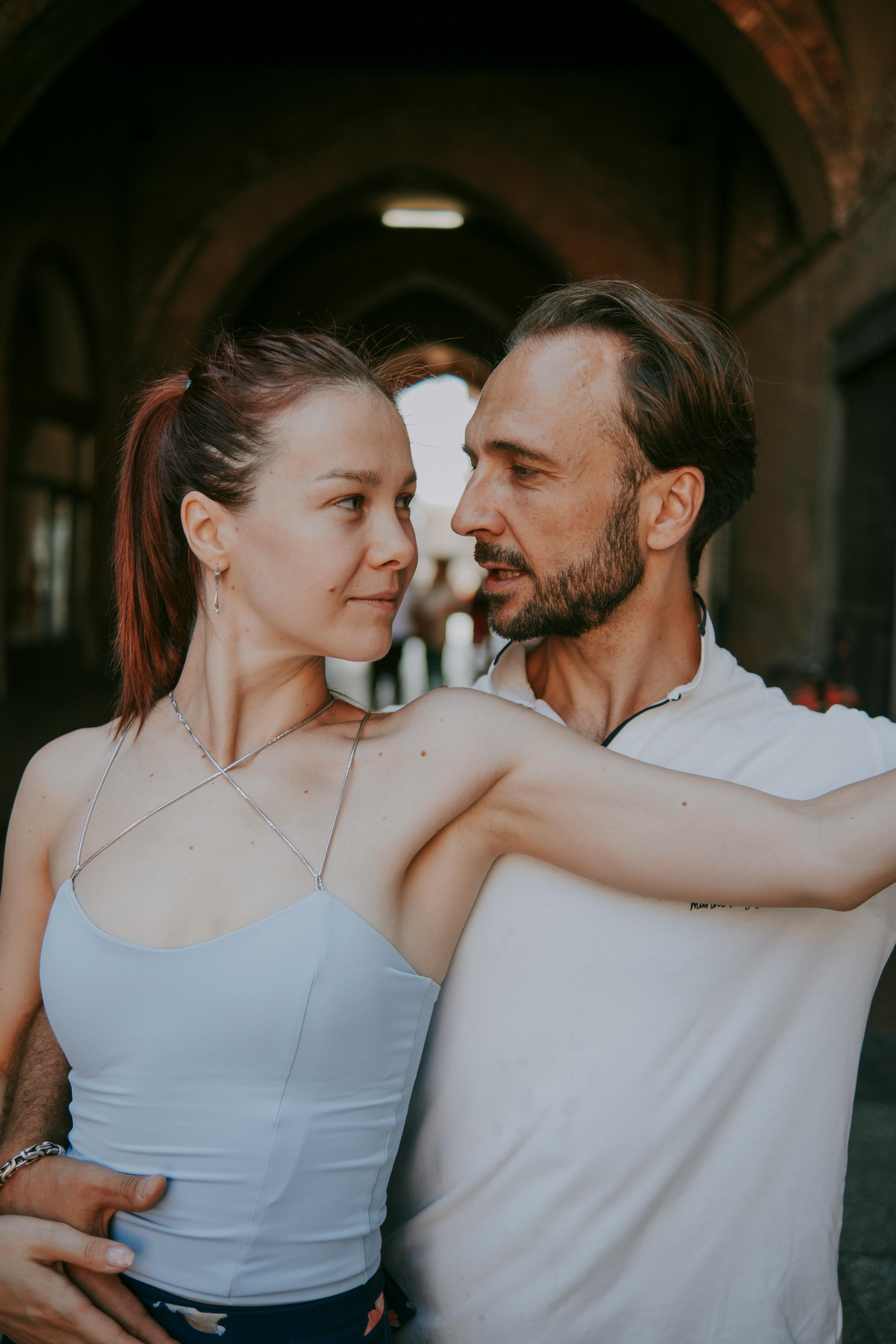 Woman in Black Tank Top Dancing with Man in Black Long Sleeve Shirt ...
