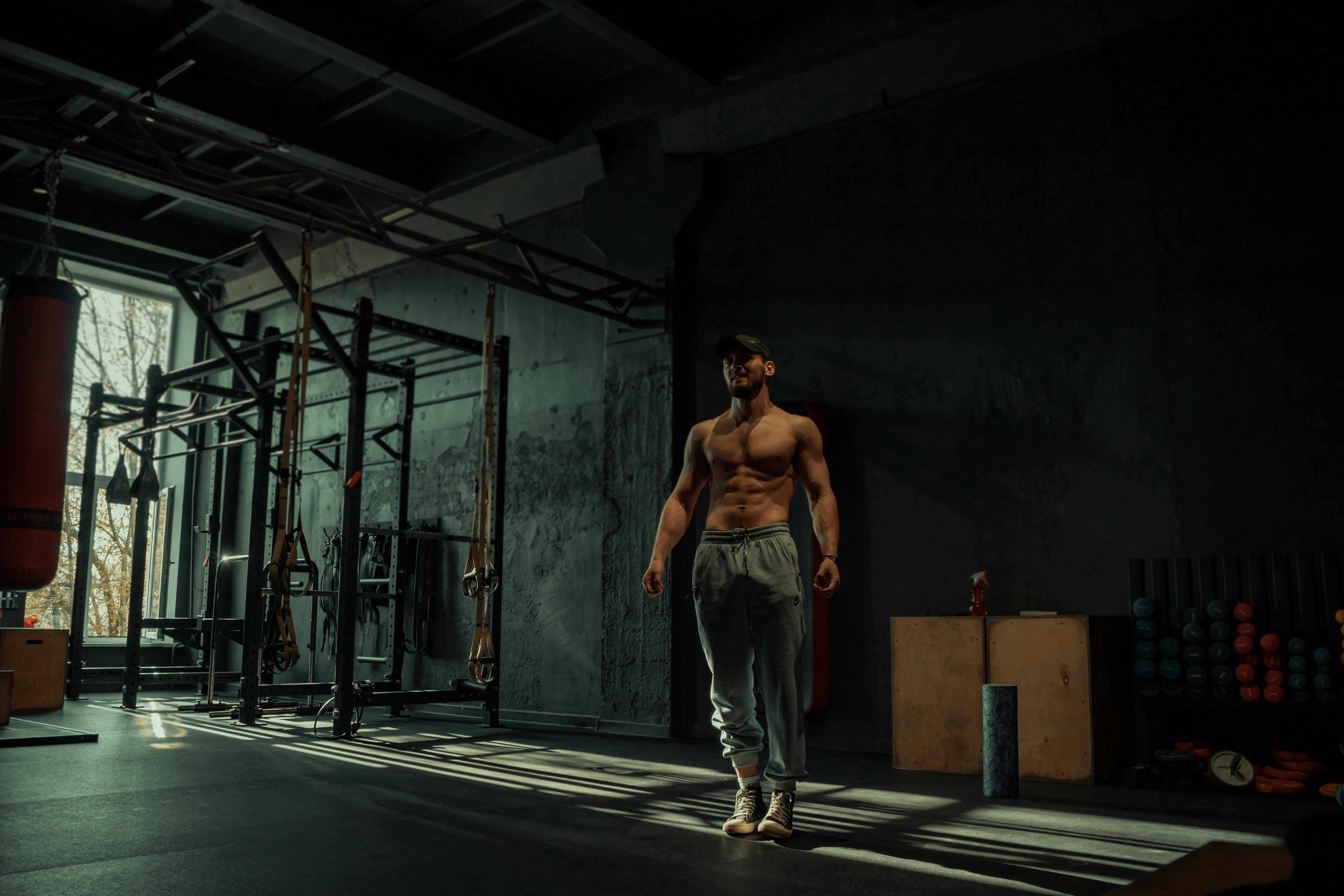 Topless Man in Shadow at Gym · Free Stock Photo