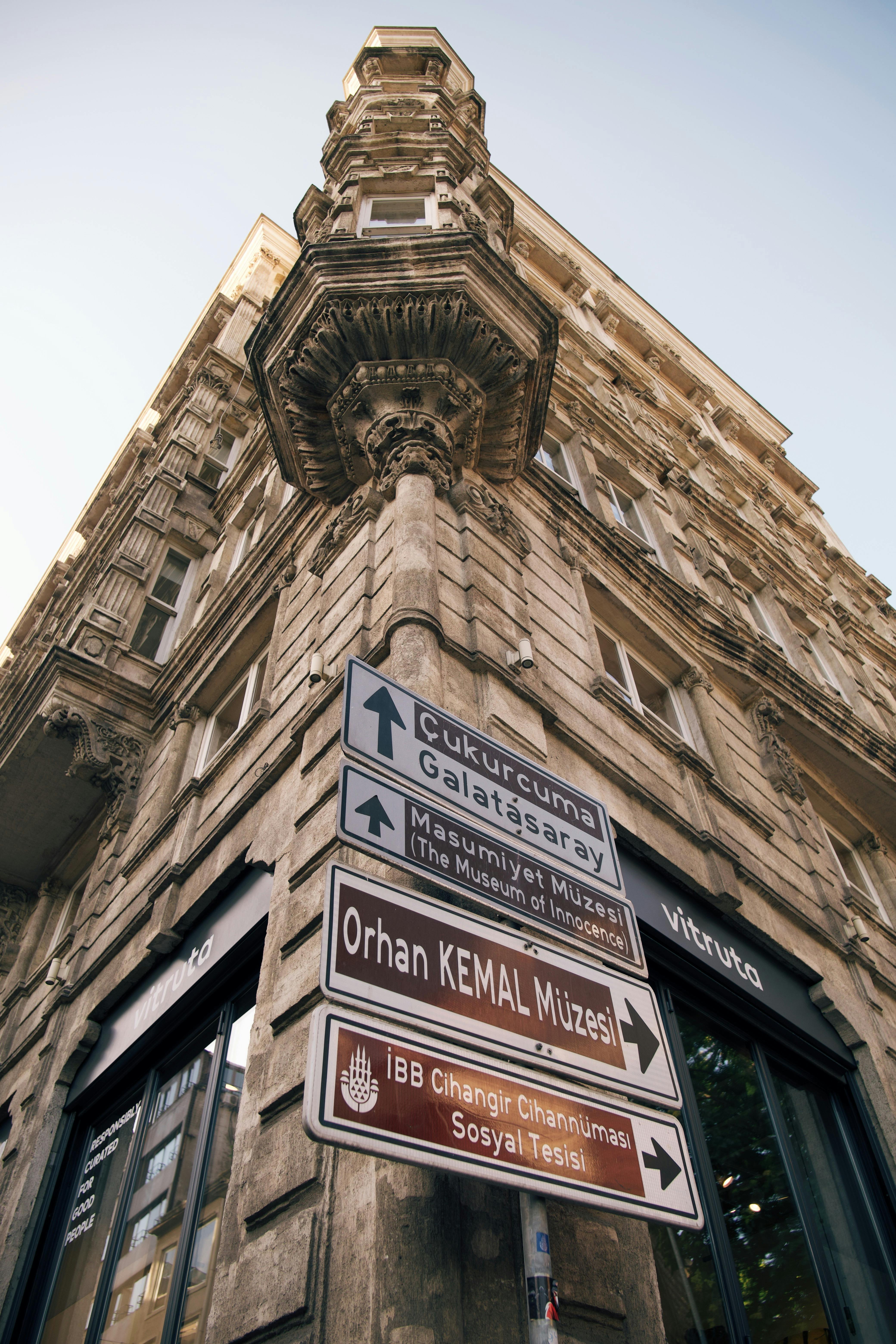 Directional Signs near Ornamented Building in Istanbul · Free Stock Photo