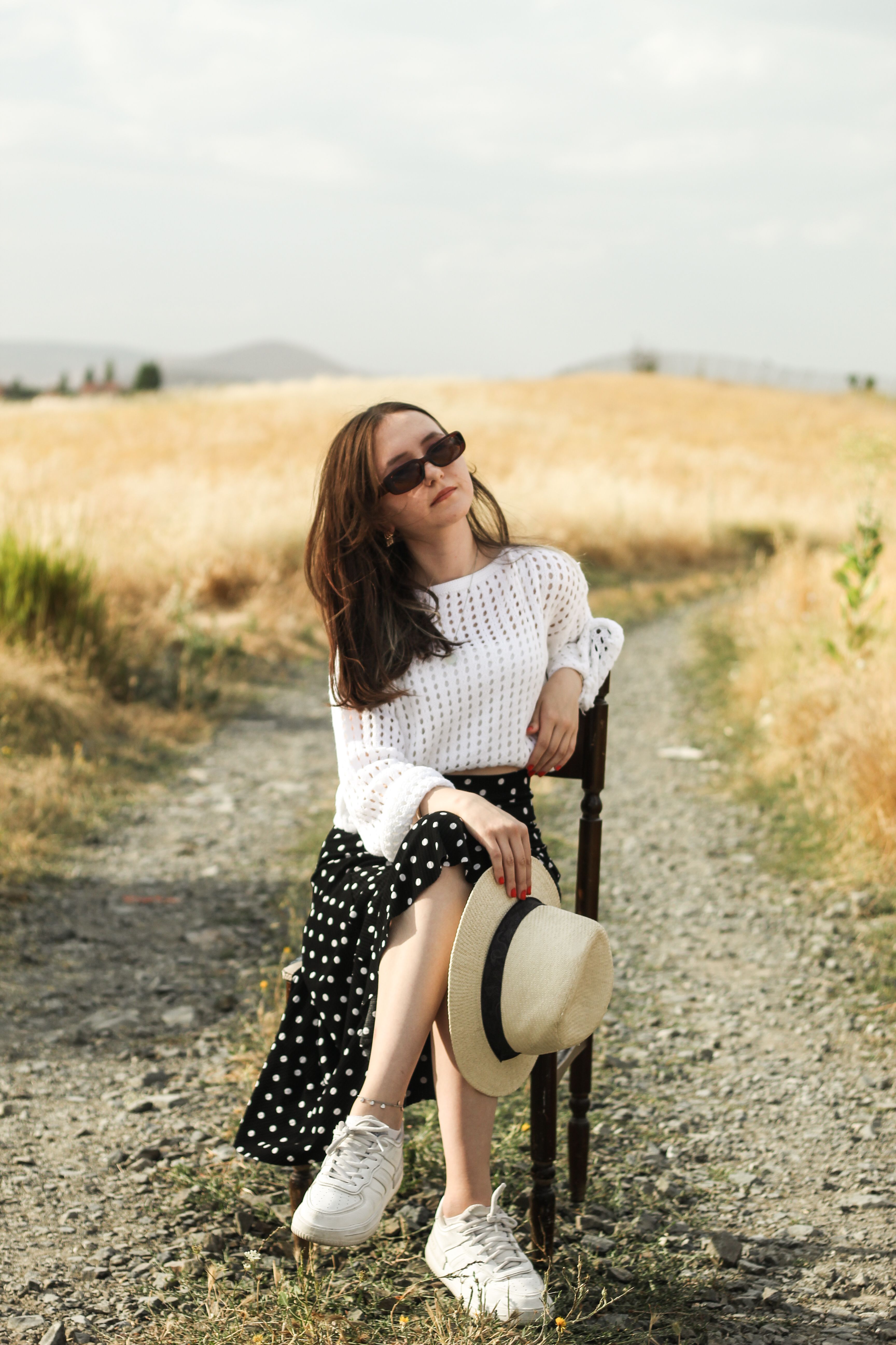Woman in Black Shirt and White Polka Dot Headscarf Smoking a Cigarette ...