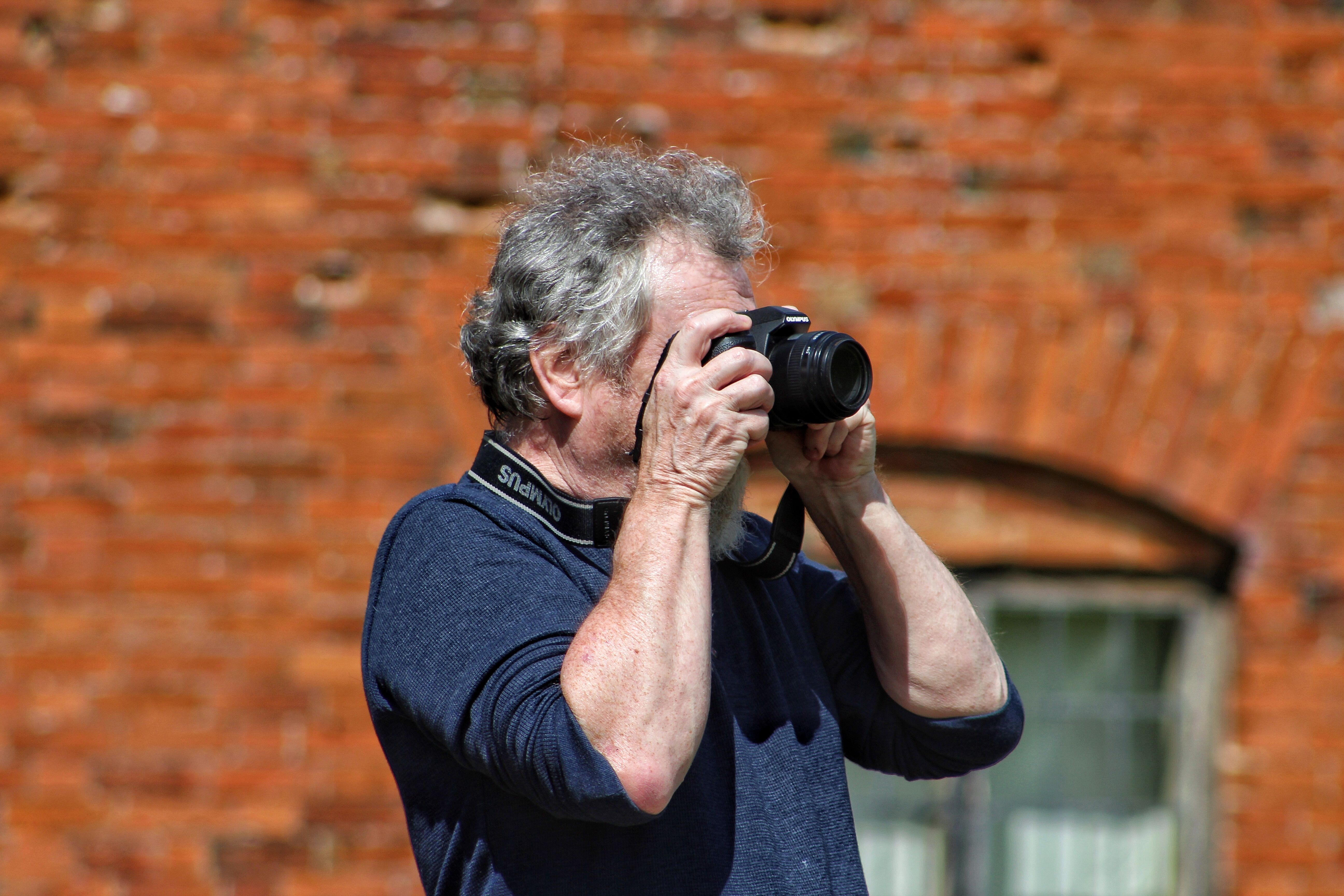Man Using a Camera · Free Stock Photo