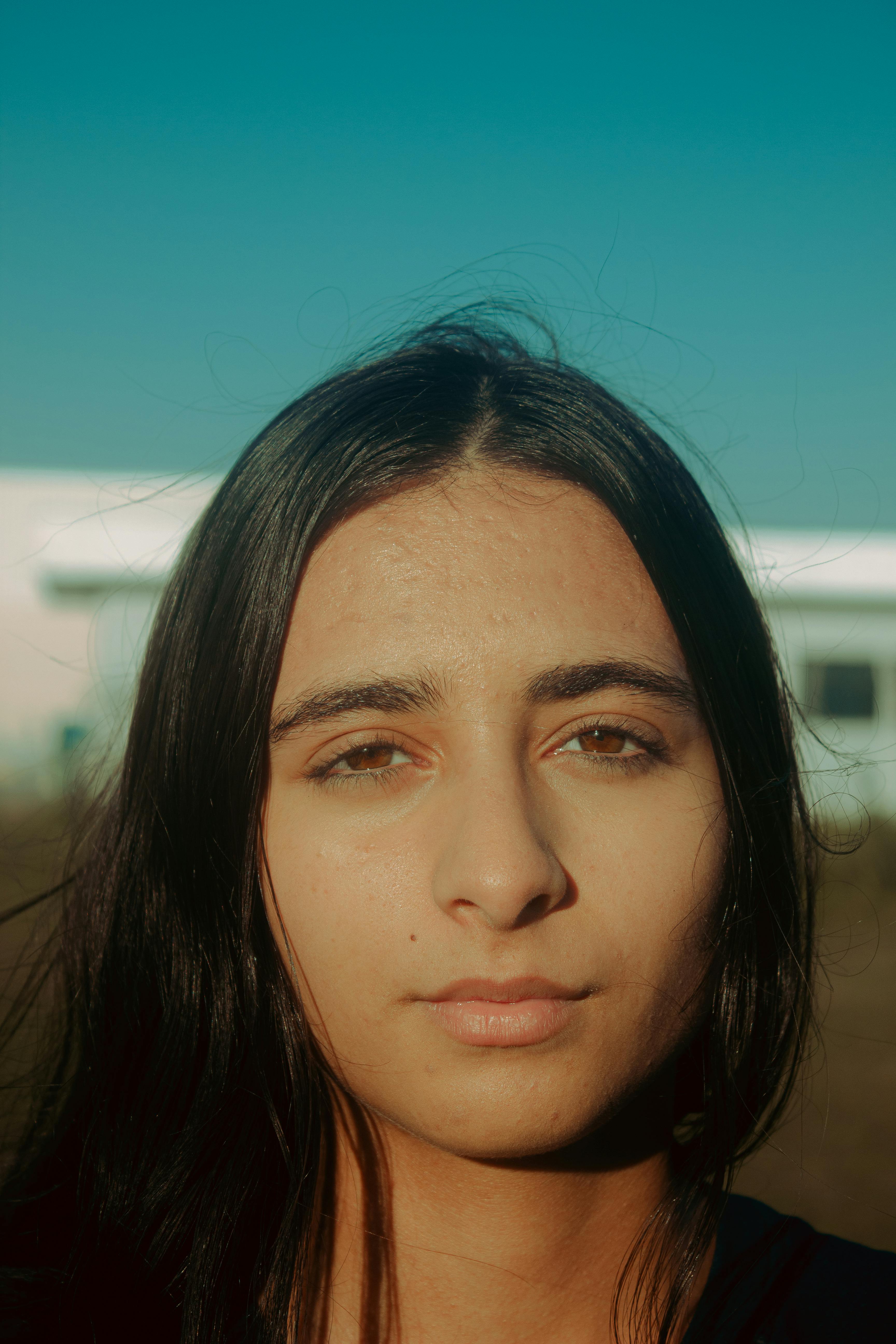 Sunlit Face of Brunette Woman · Free Stock Photo