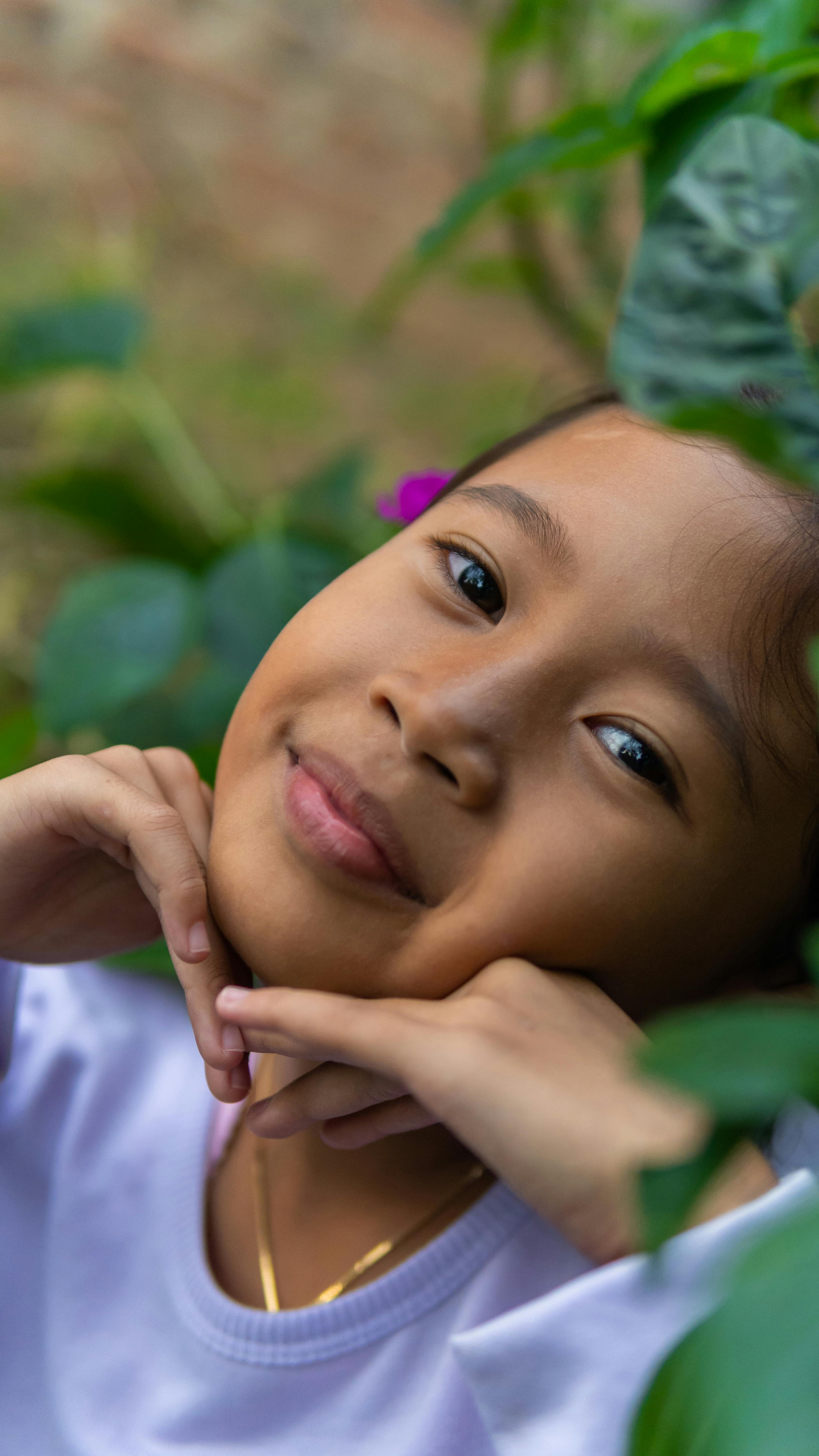 Little Girl with Her Face Resting on Hands · Free Stock Photo