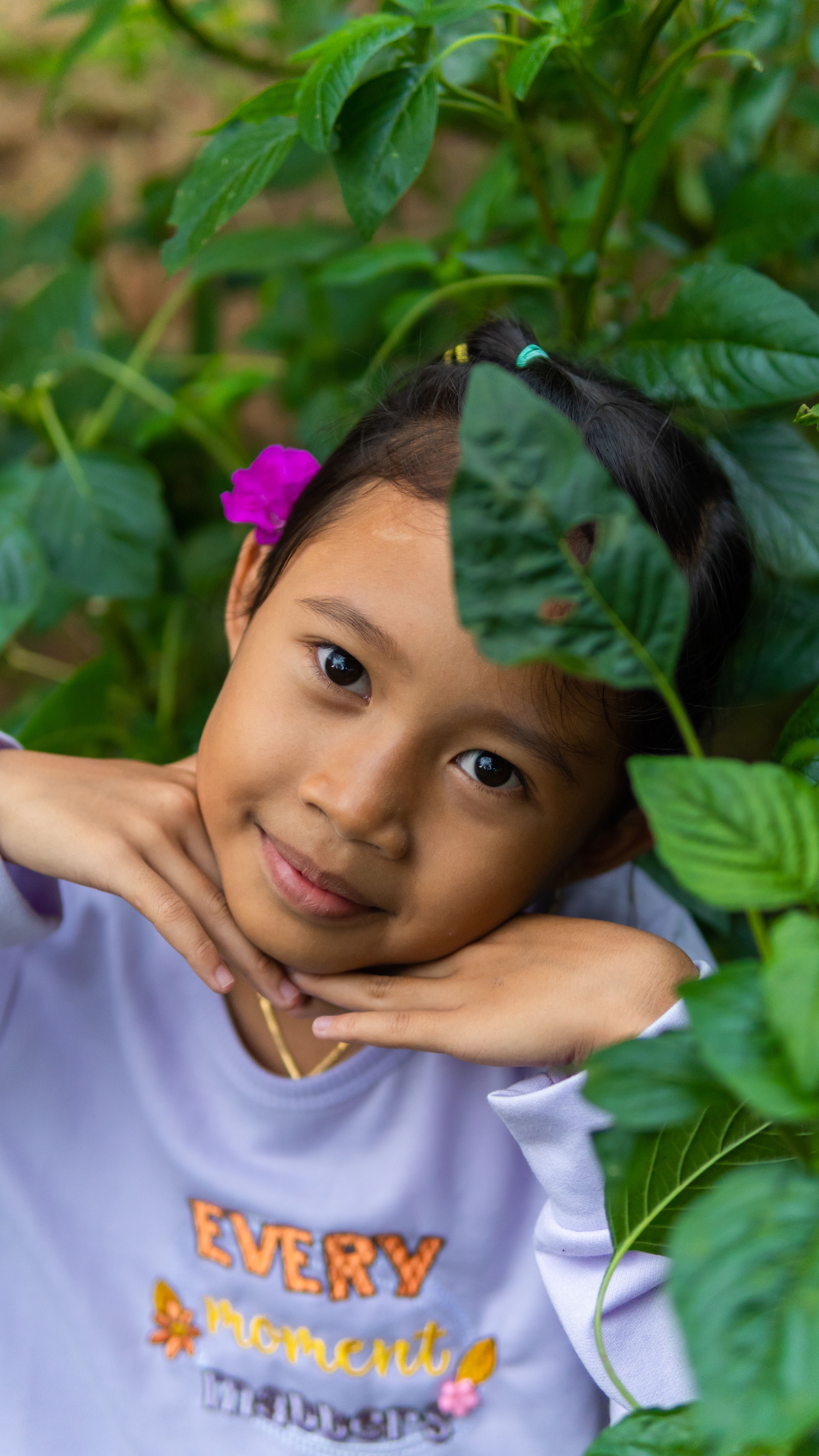 Small Child Posing with Her Hands Under Her Face · Free Stock Photo