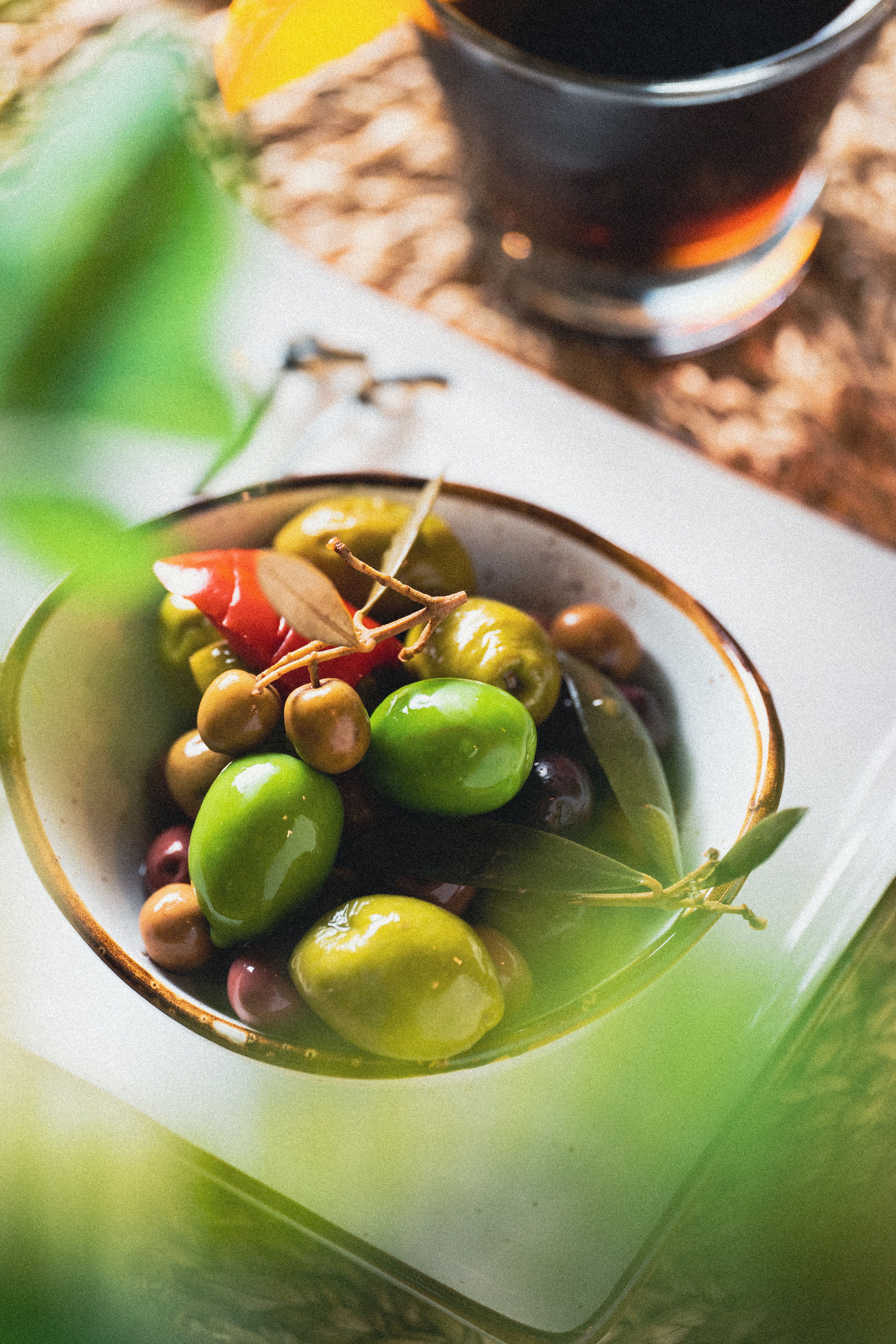 A bowl of olives and a cup of coffee · Free Stock Photo