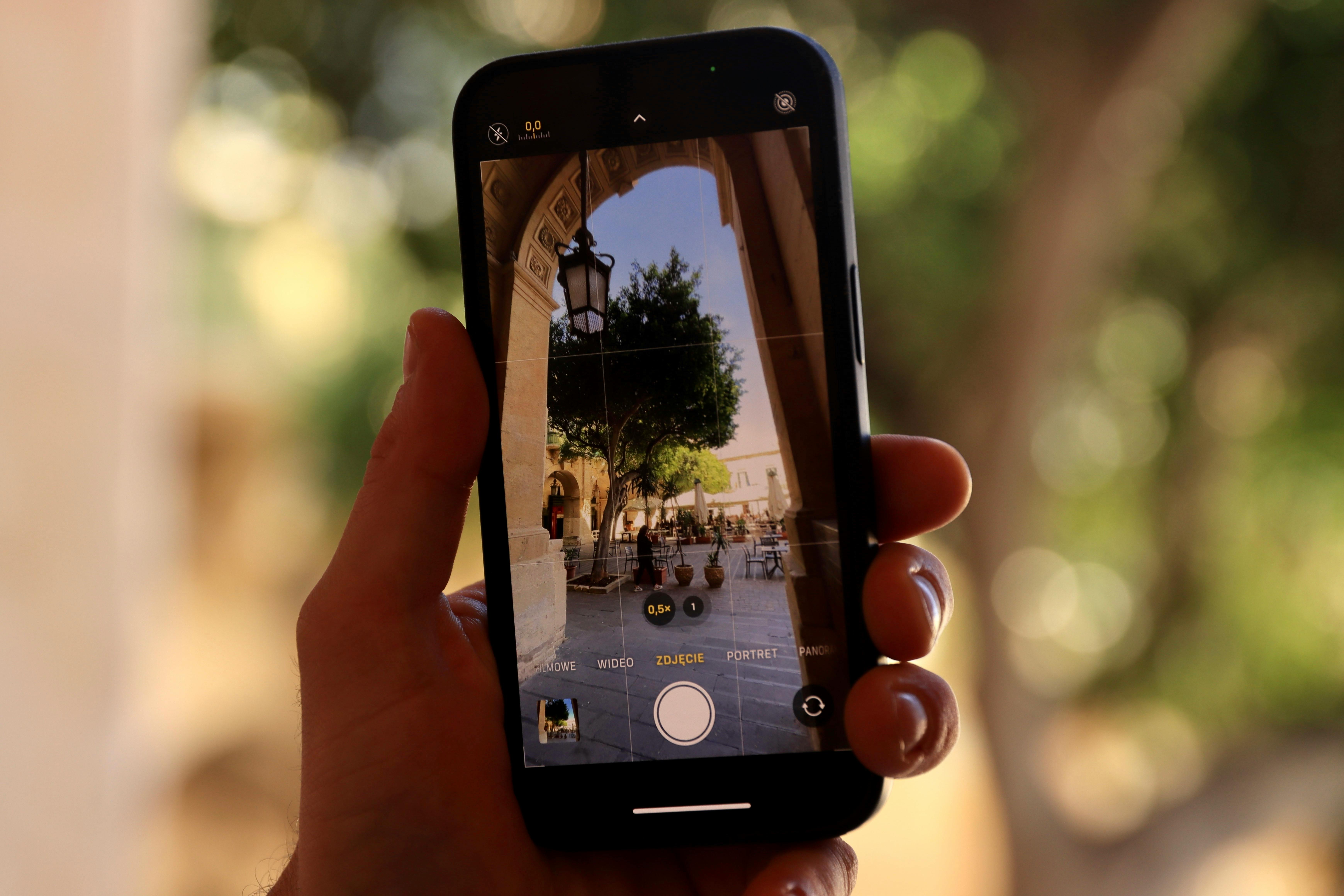 Hand Holding Smartphone and Taking Pictures · Free Stock Photo