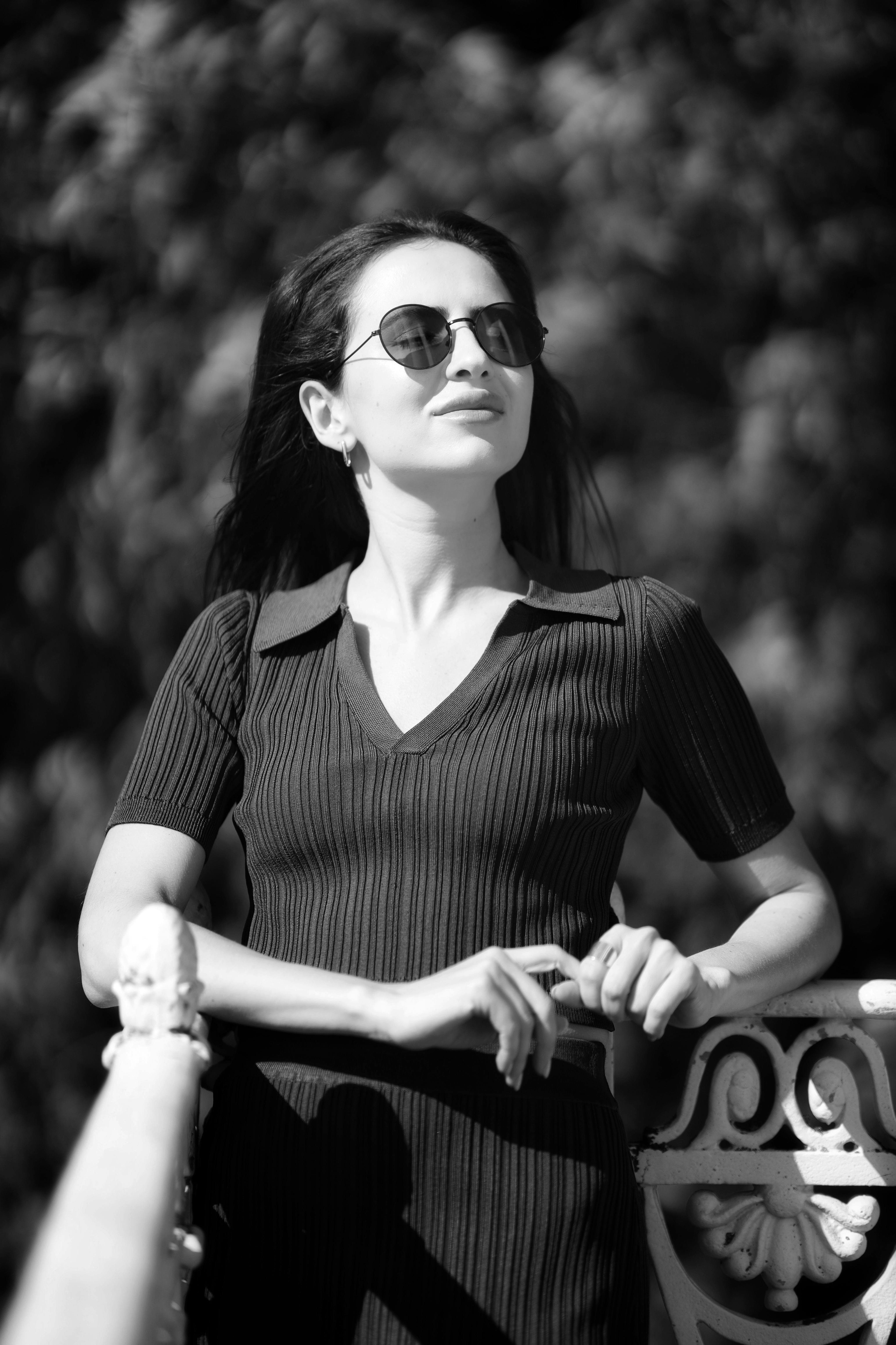 Charming model standing against white sheet in nature · Free Stock Photo