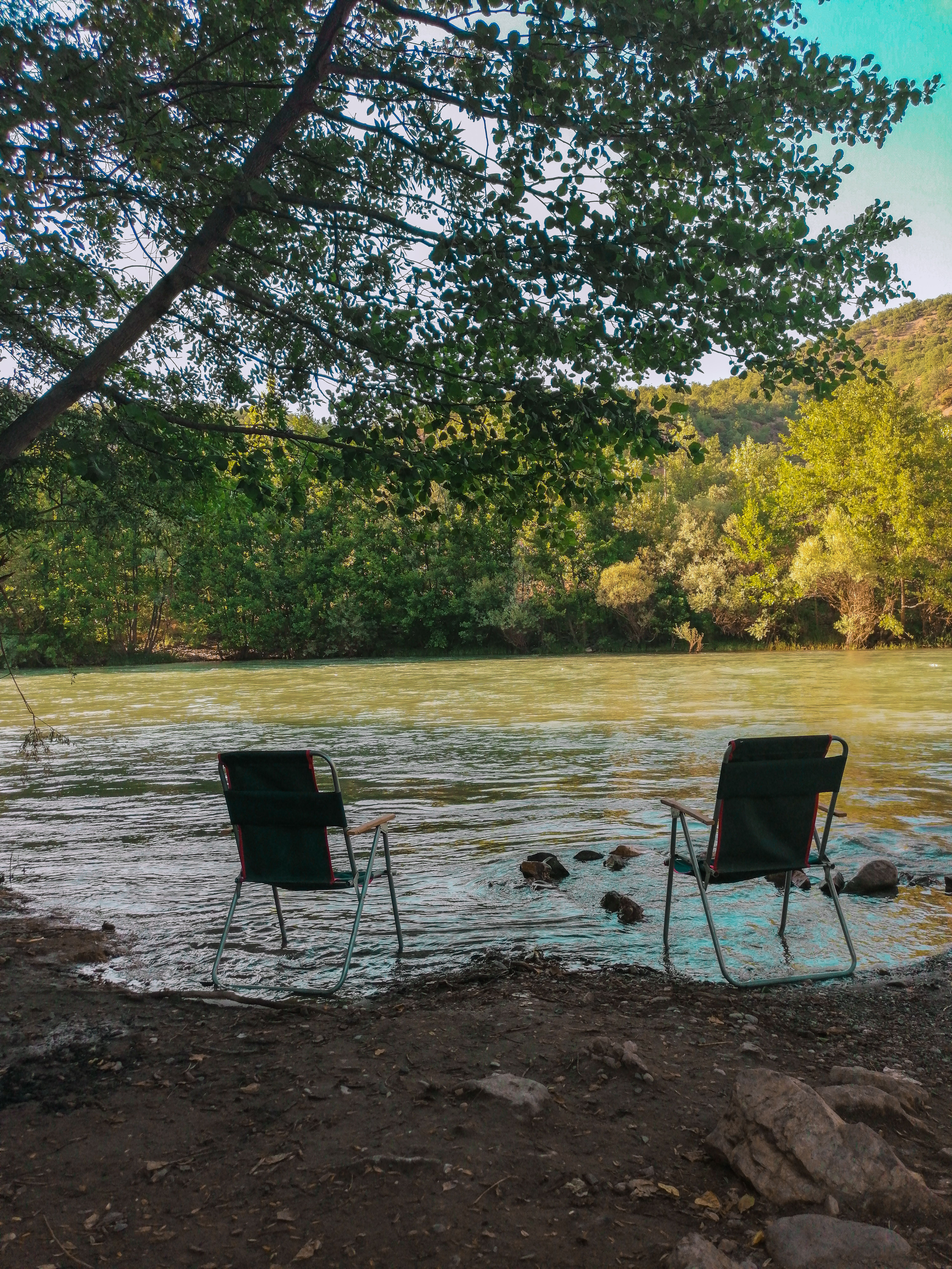 Two Chairs by a River · Free Stock Photo