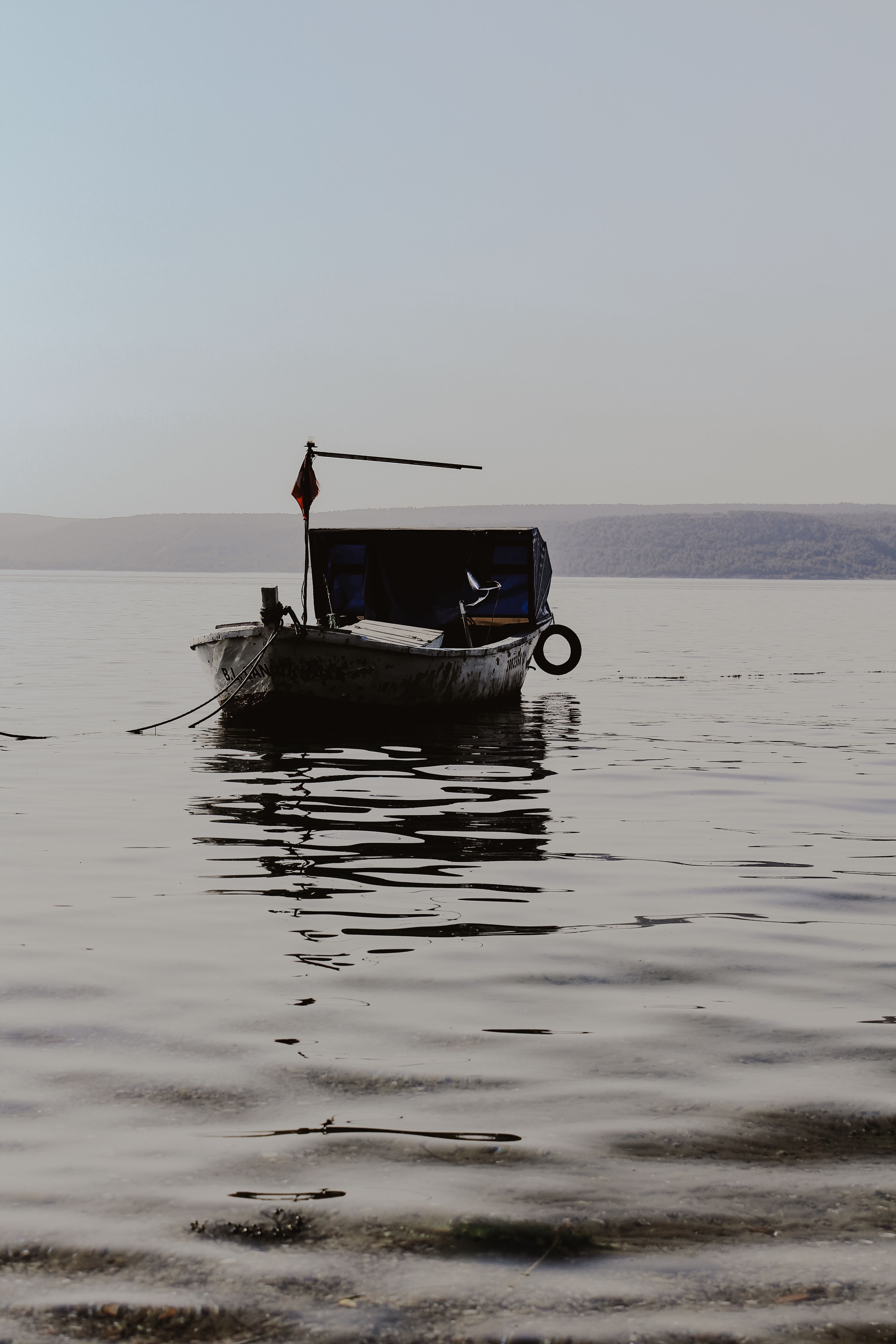 Brown Canoe on Calm Body of Water · Free Stock Photo