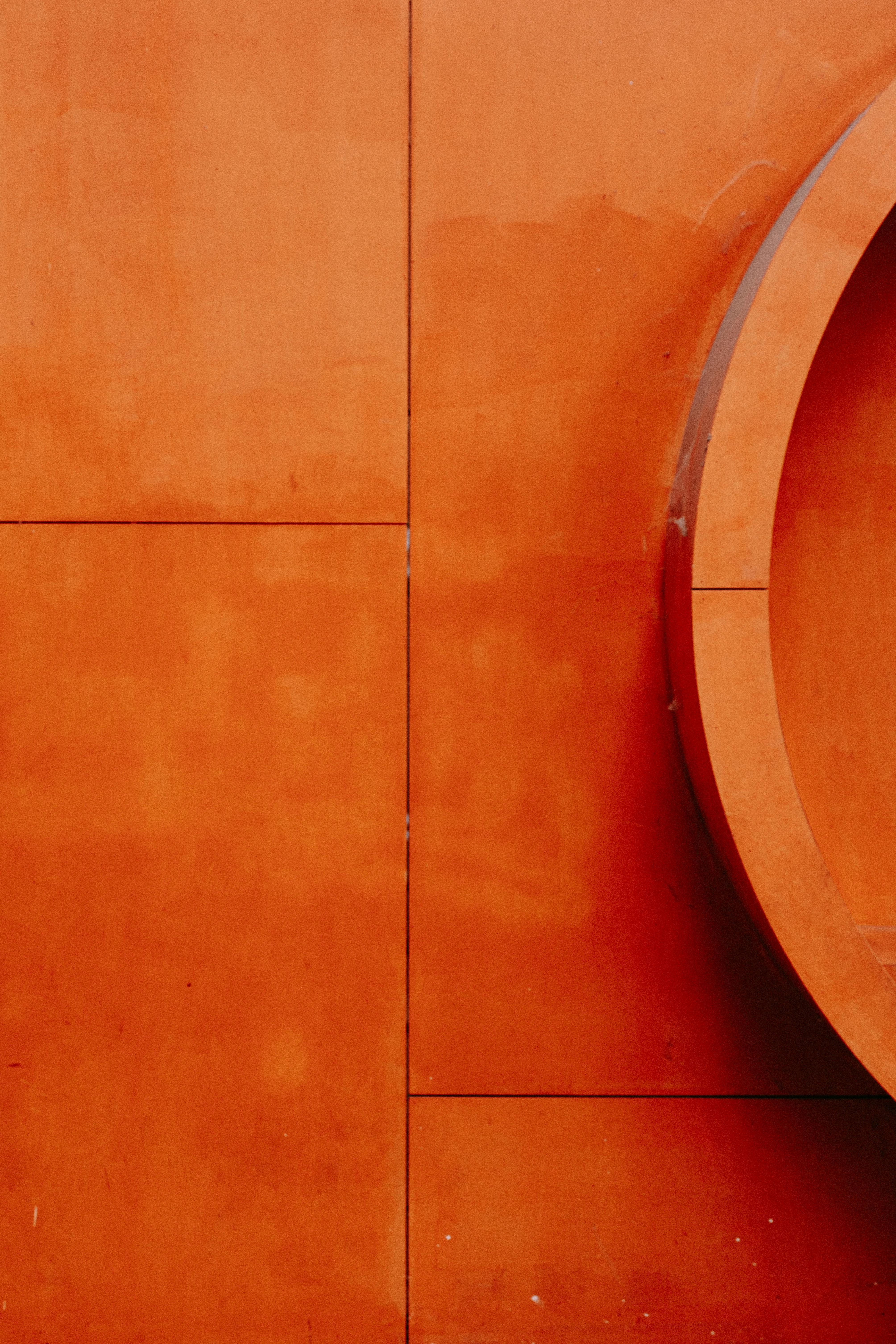 A close up of a circular orange wall · Free Stock Photo
