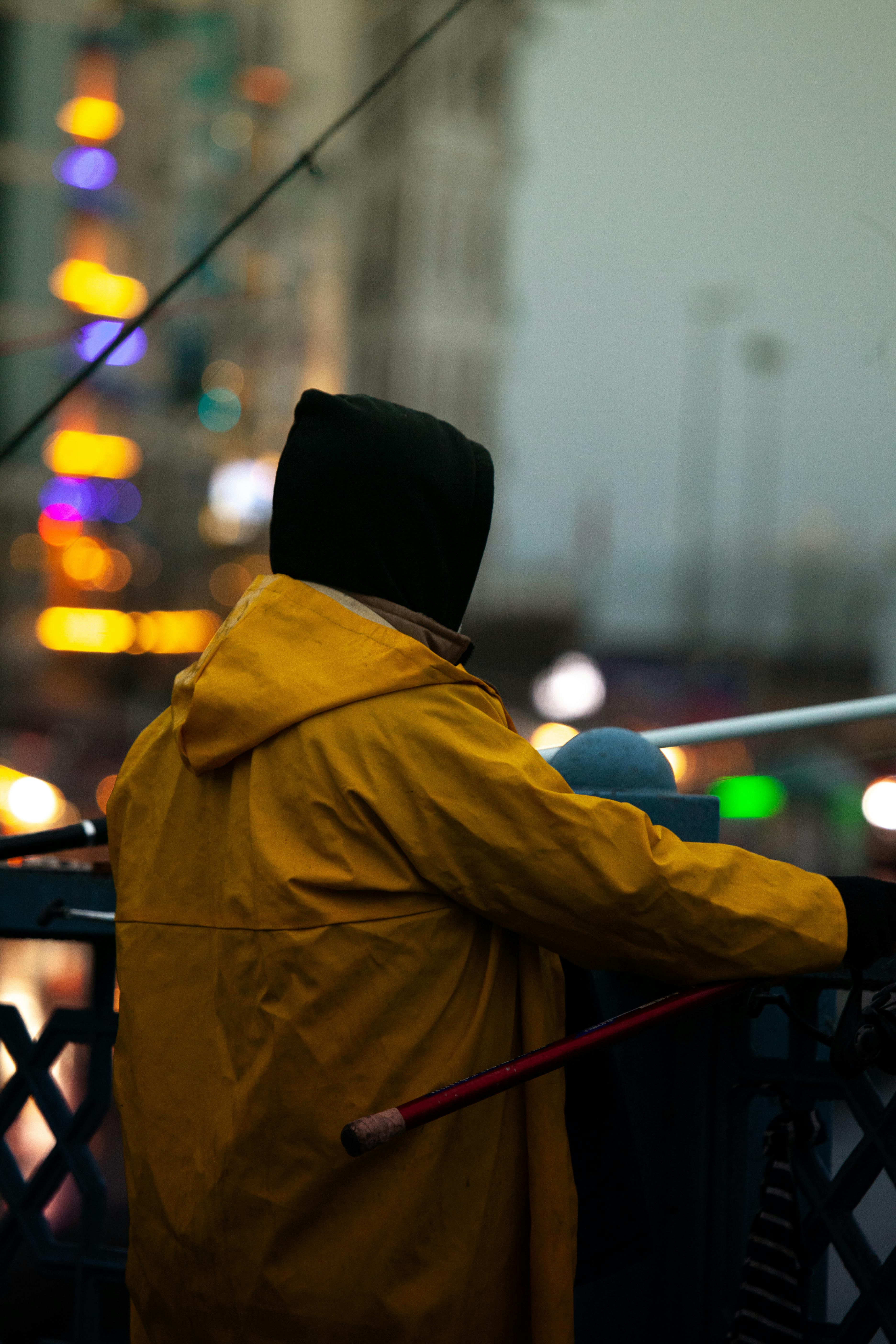 Back View of a Man Fishing from a Bridge · Free Stock Photo