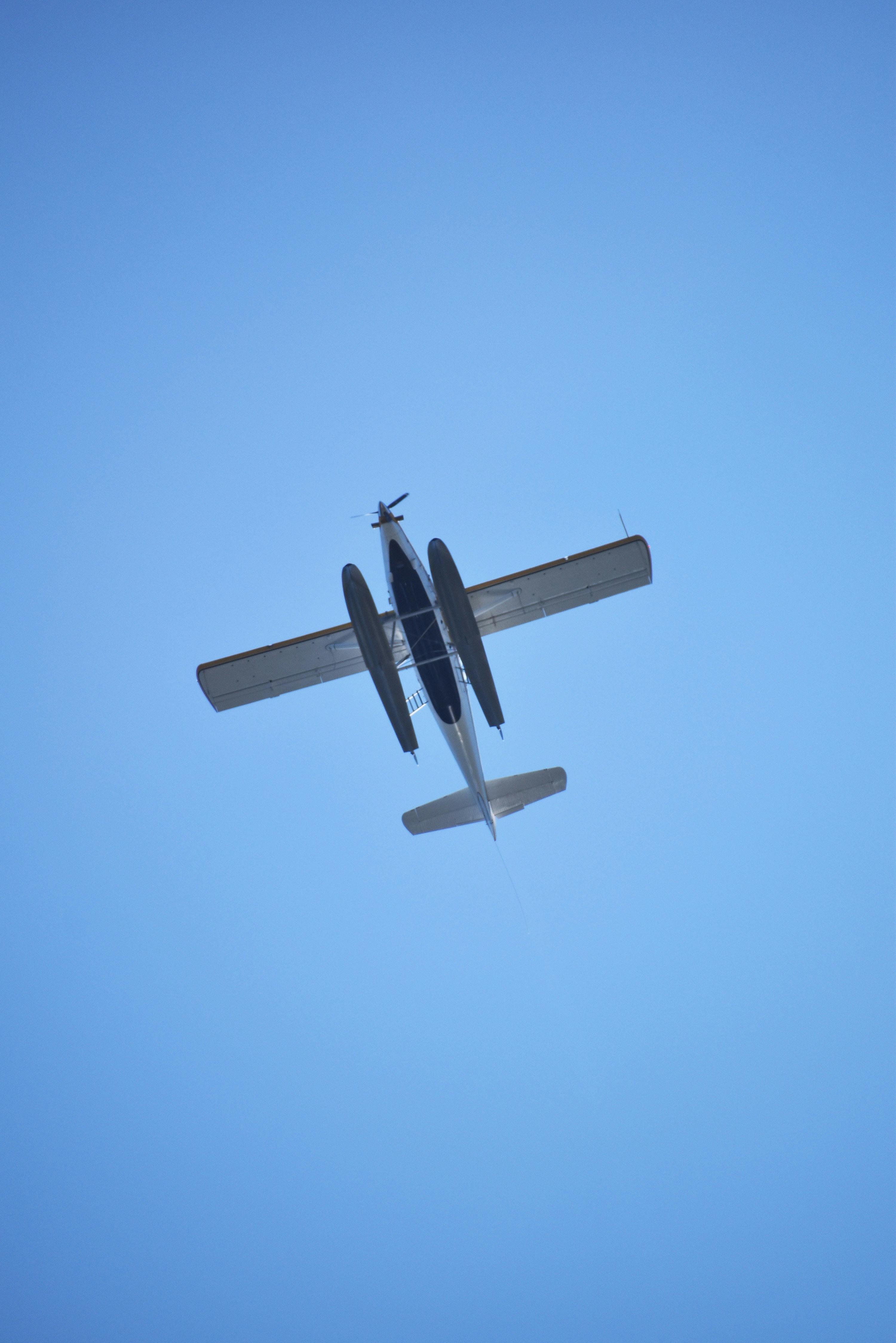 A small airplane flying in the sky · Free Stock Photo
