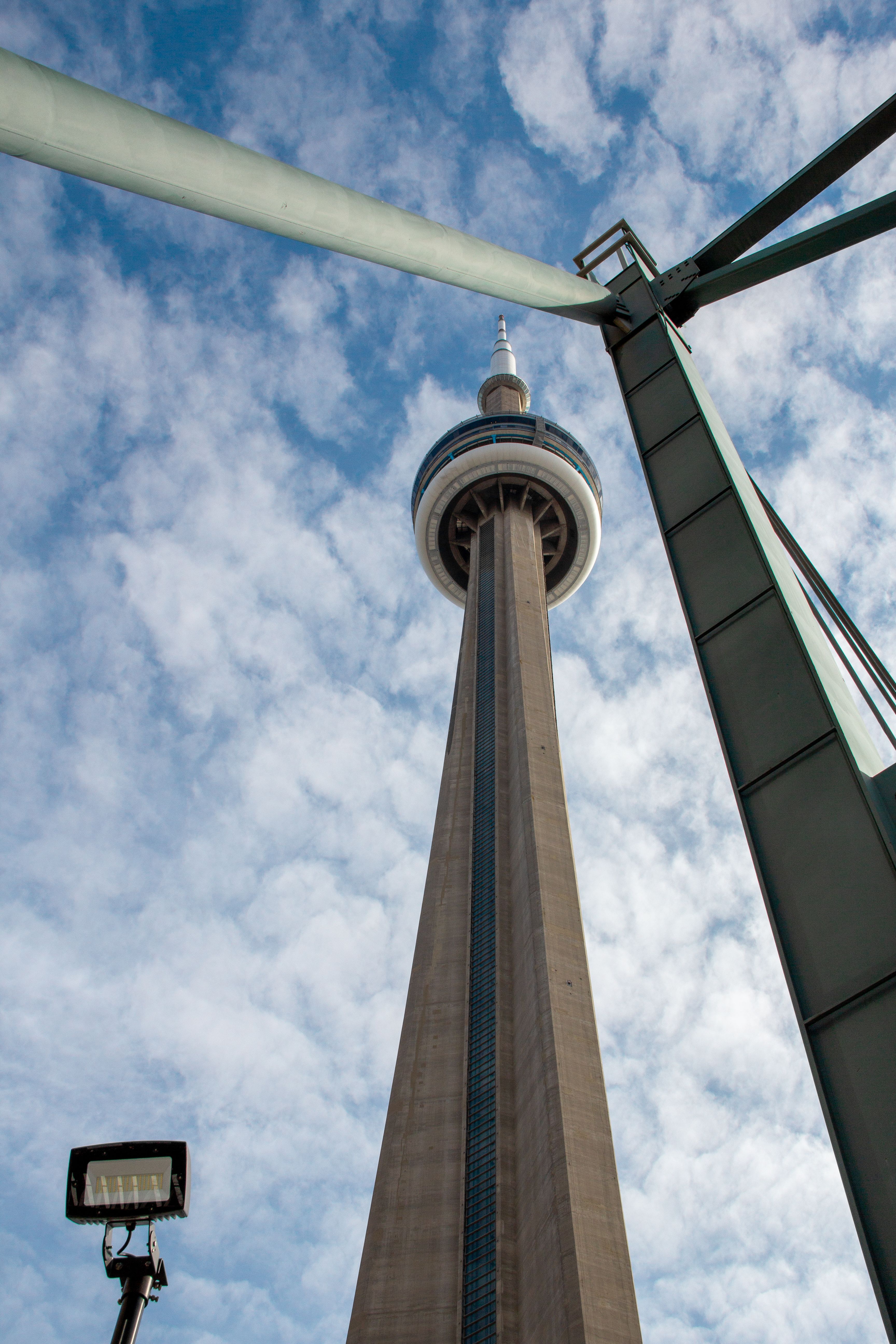 The cn tower is seen from the ground · Free Stock Photo