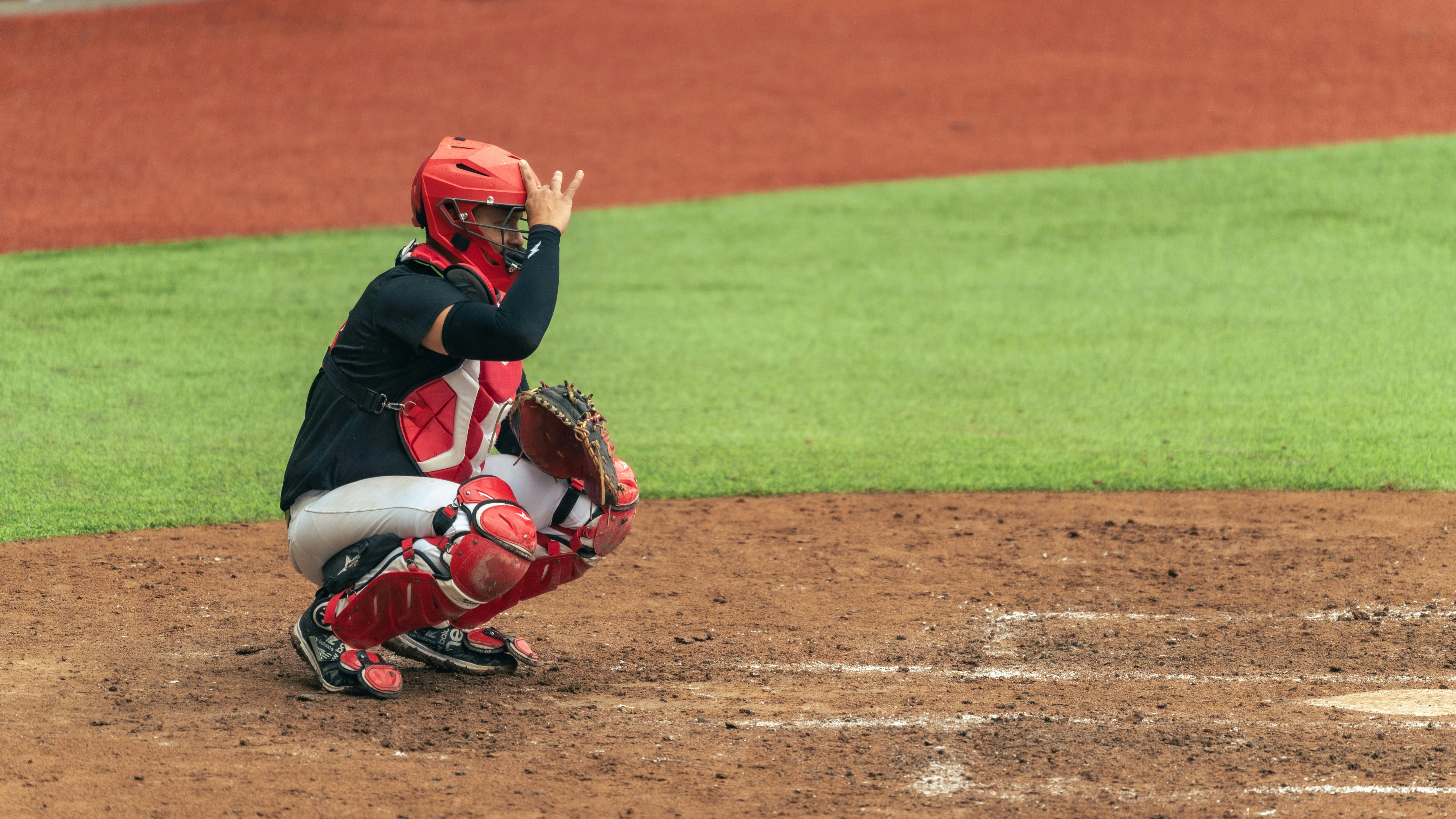 White and Red Baseball Player With Black Face Helmet and Brown Leather ...