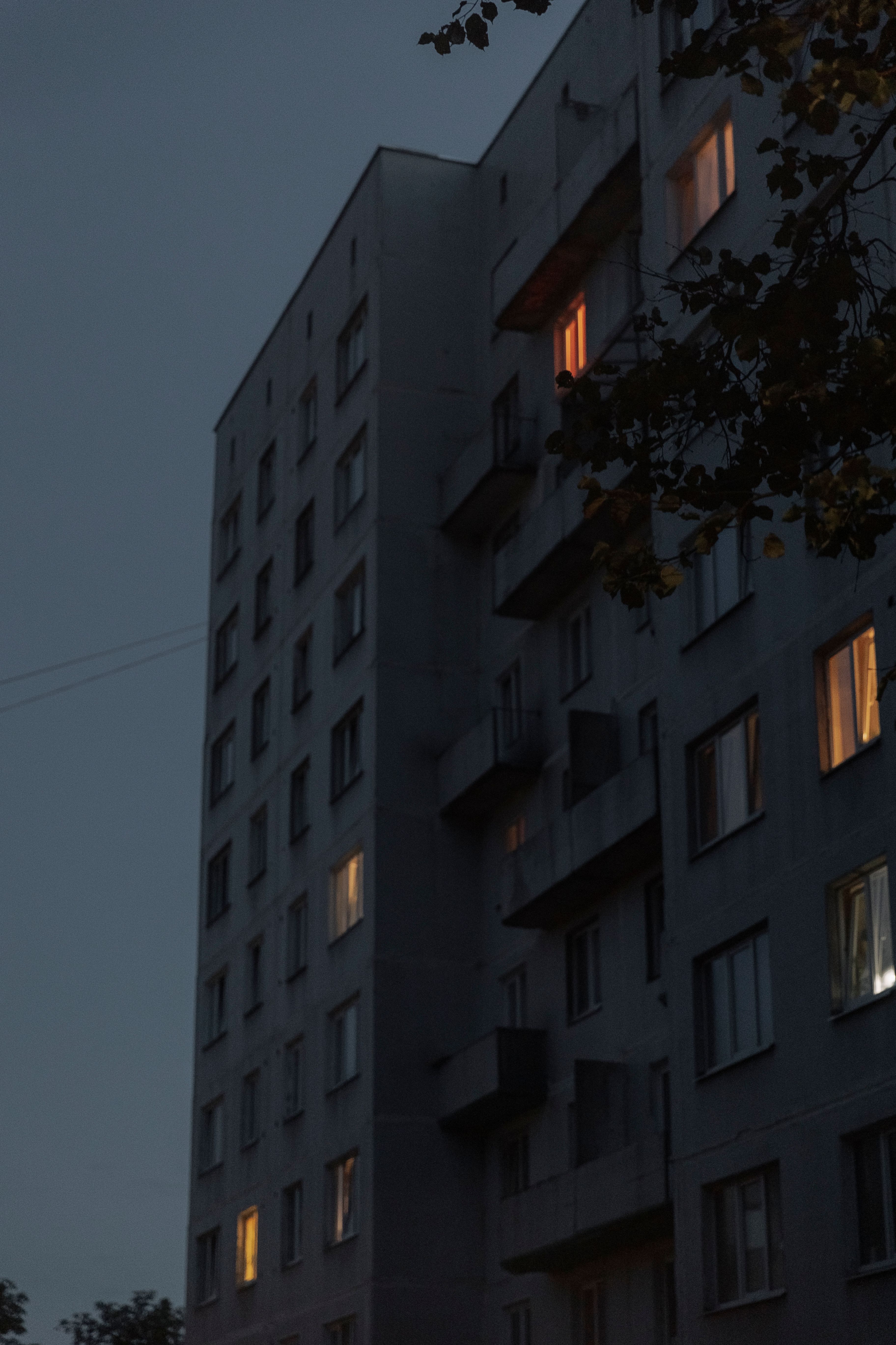 A building with windows lit up at night · Free Stock Photo