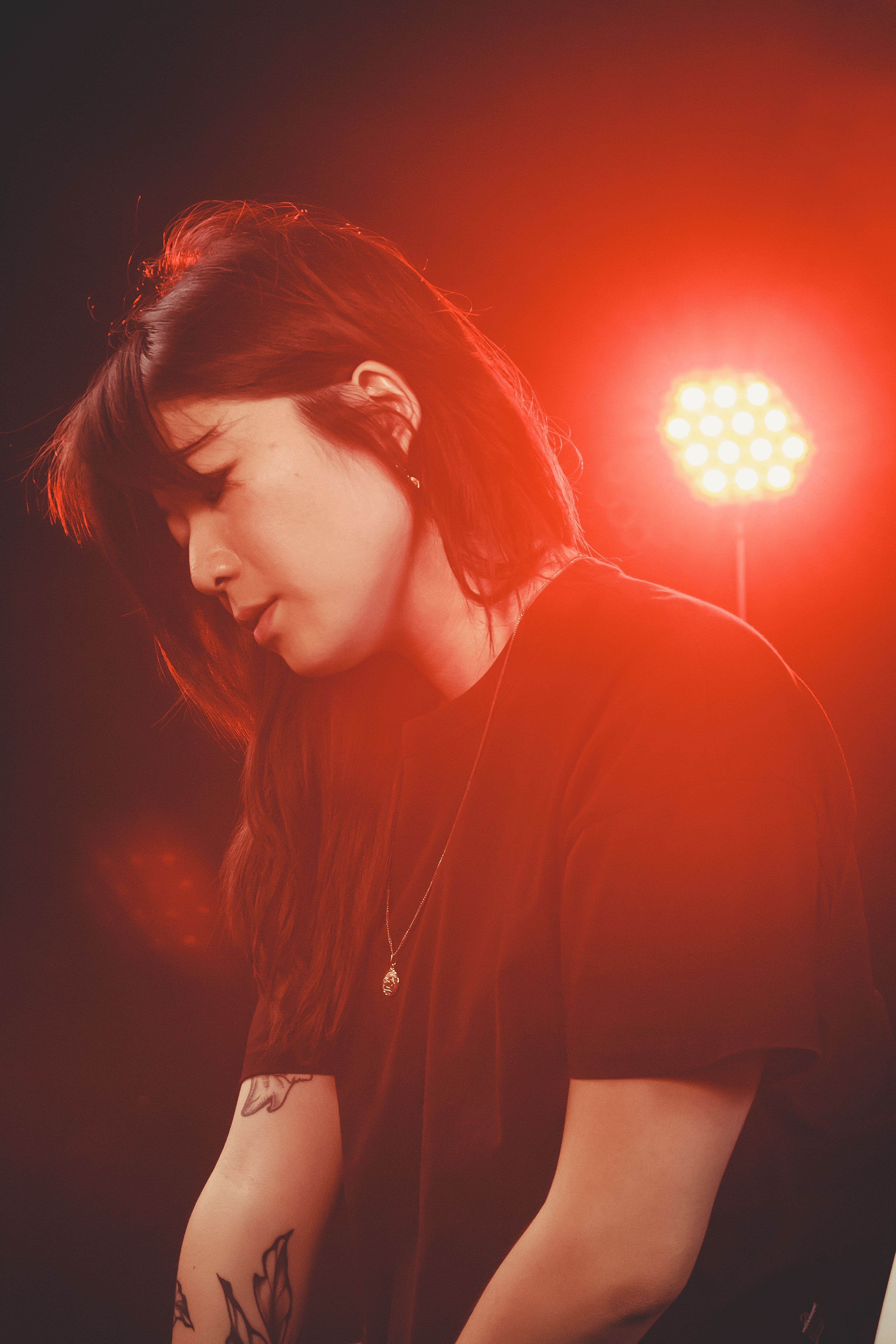 Brunette Woman in Red Light · Free Stock Photo