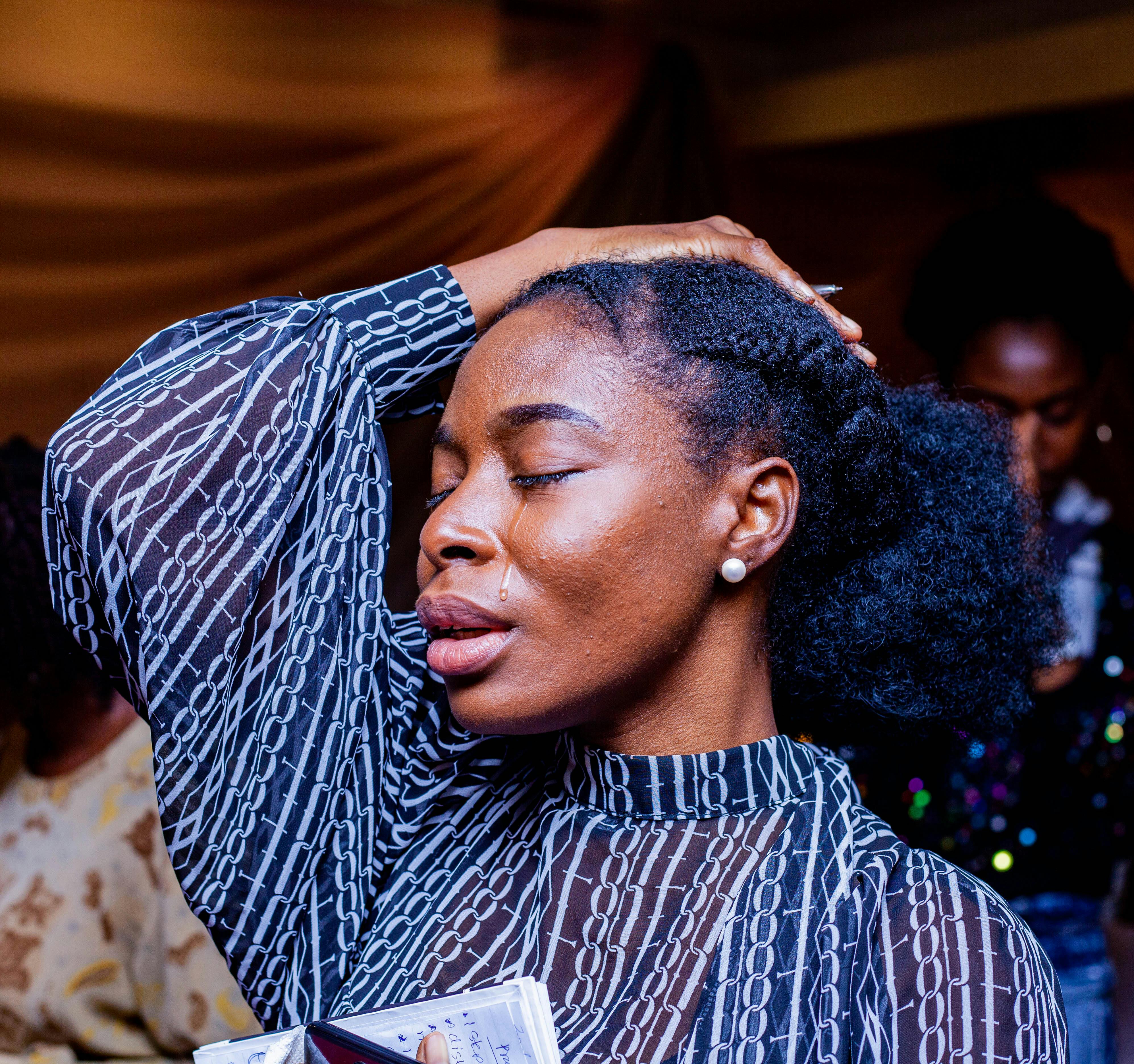 Woman crying during worship · Free Stock Photo