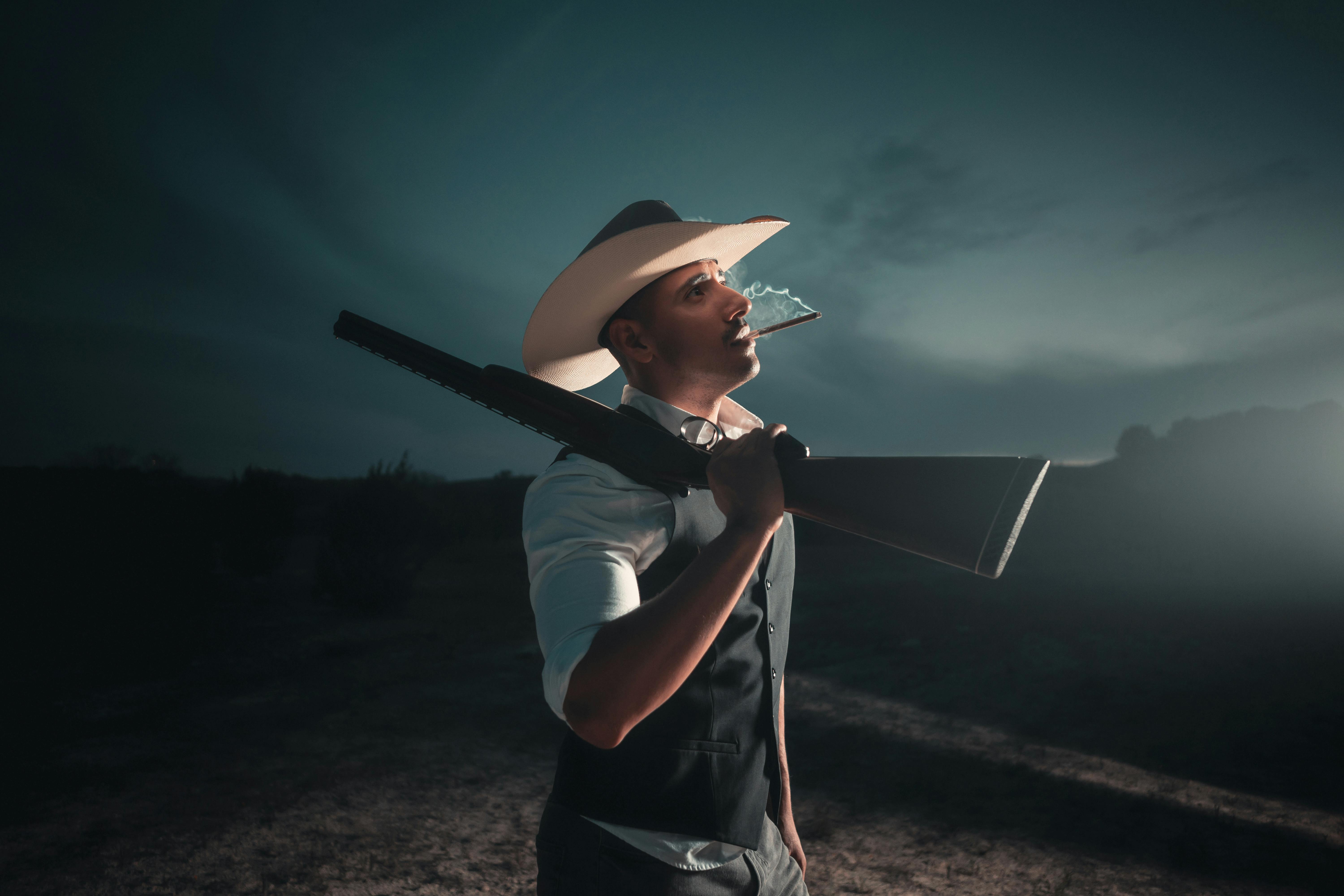 Smoking Cowboy with Shotgun · Free Stock Photo