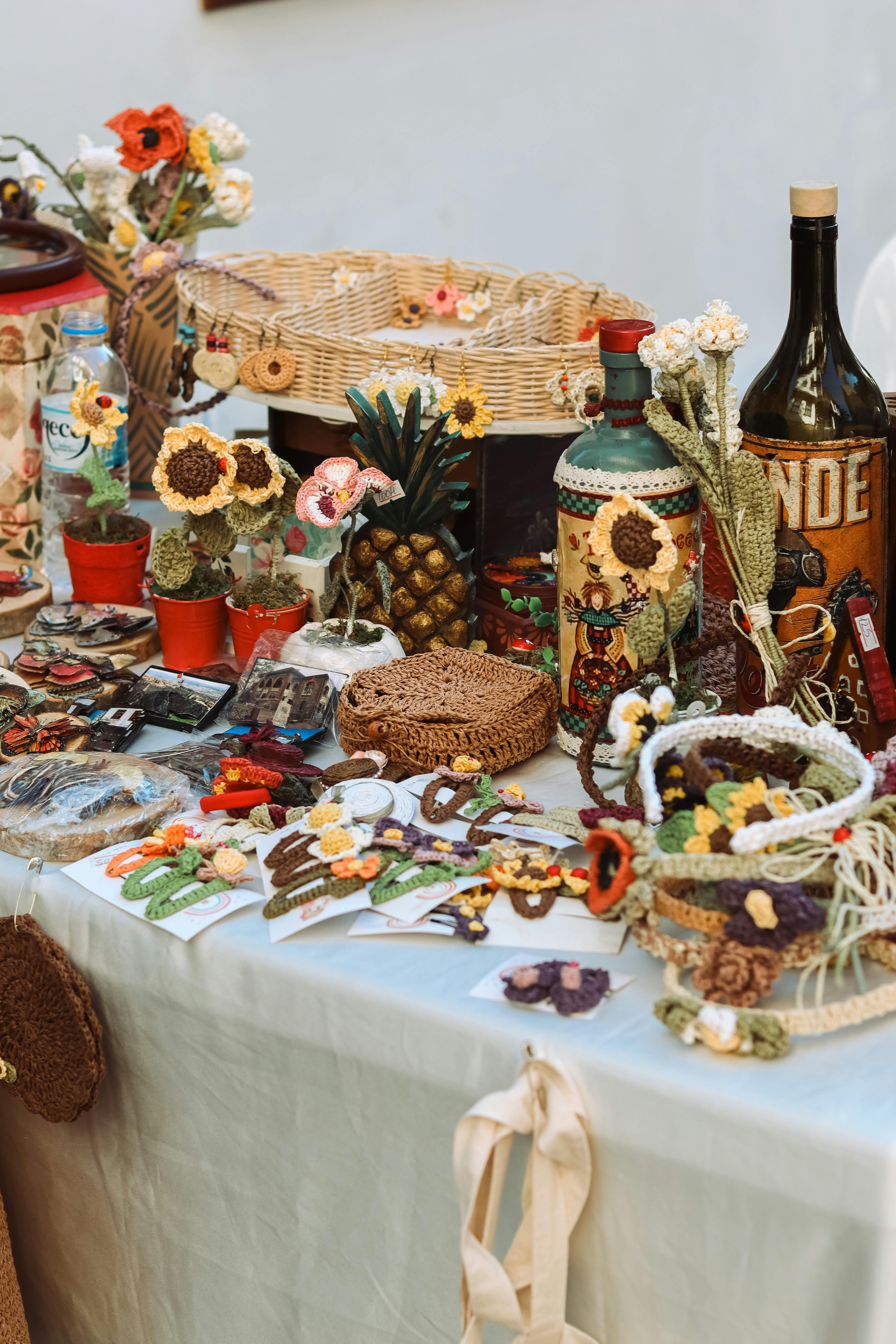 Handcrafted Items Displayed in a Market Table · Free Stock Photo
