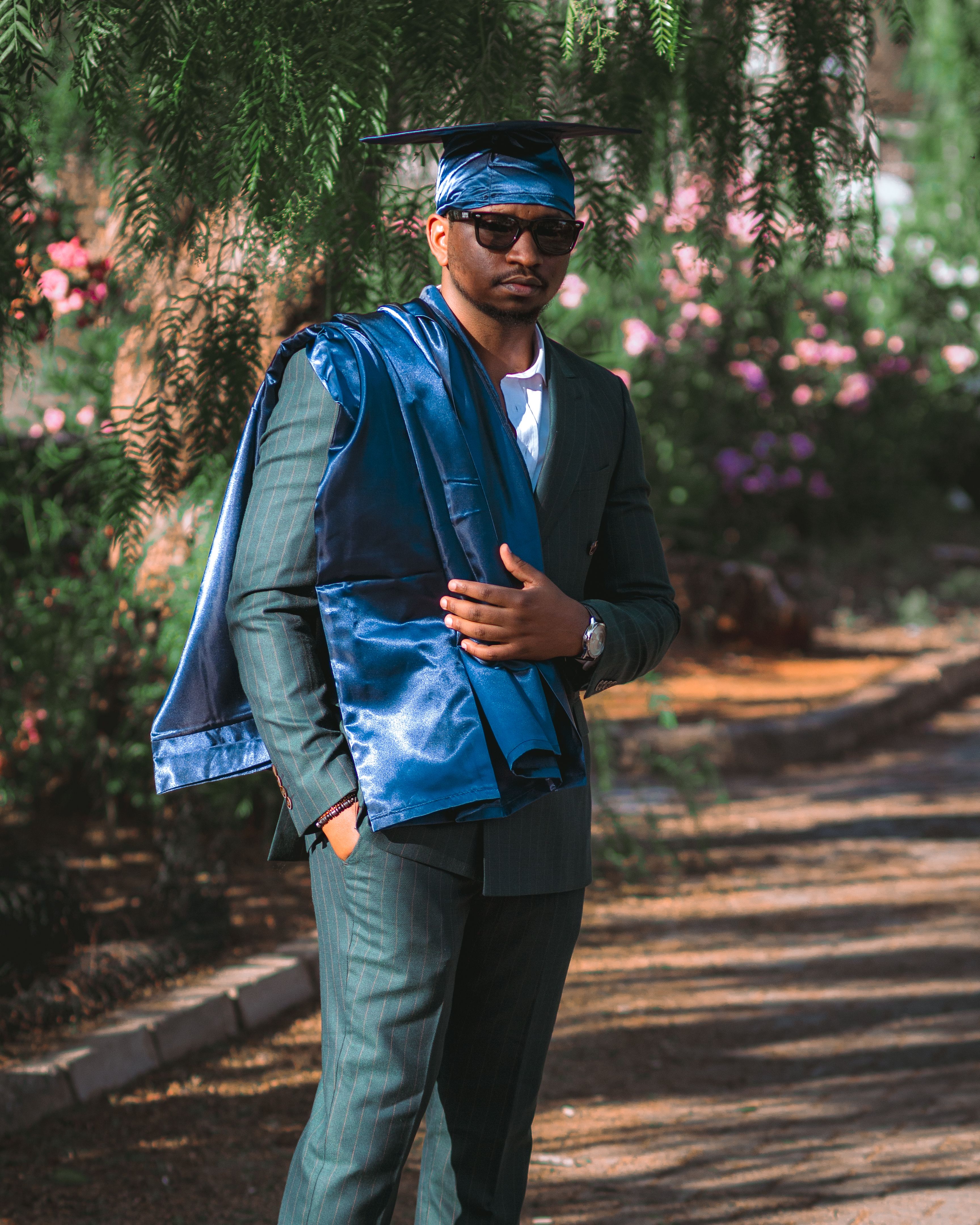 Portrait of Graduate in Suit and Traditional Clothing · Free Stock Photo