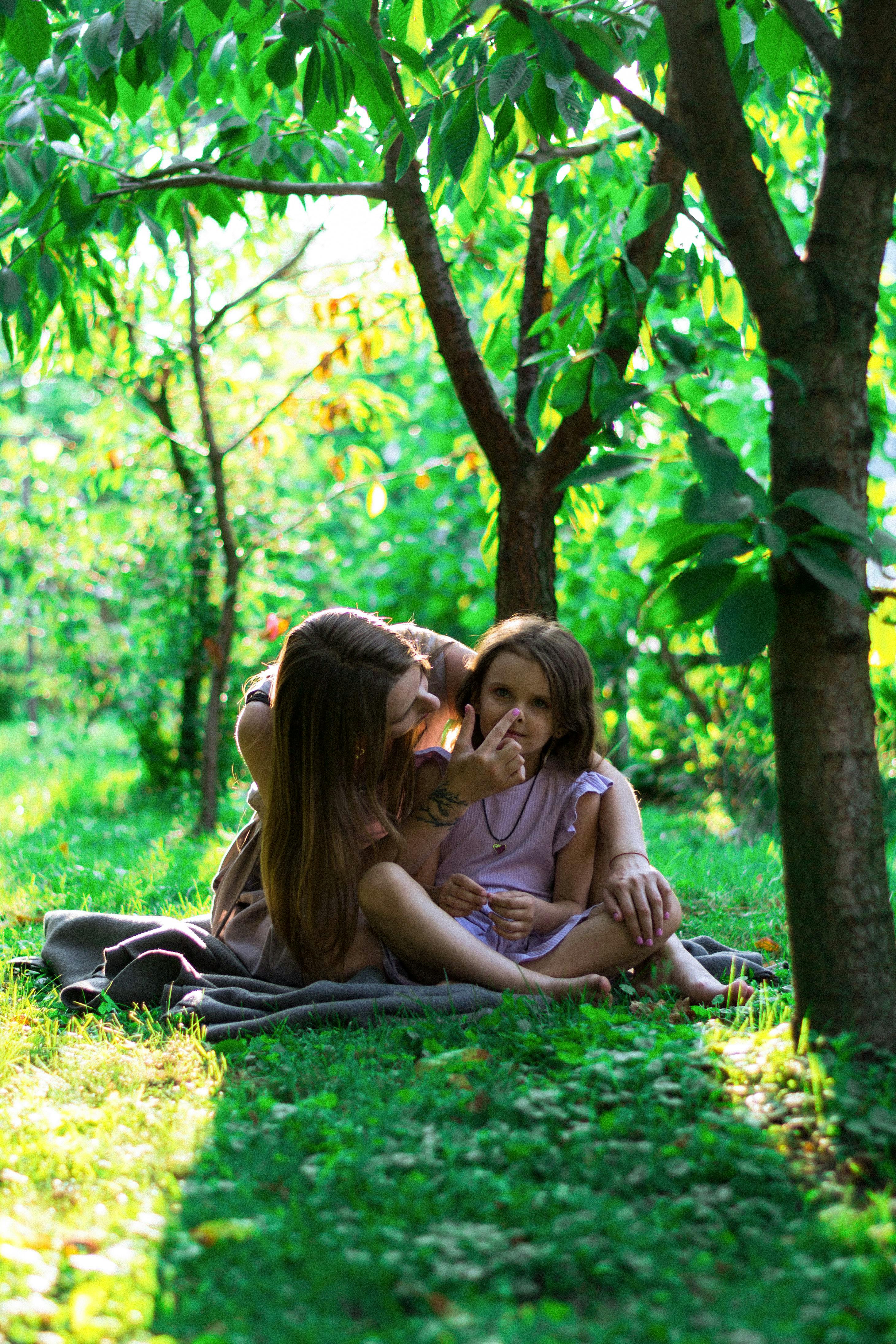 A Family Sitting on their Home Patio · Free Stock Photo