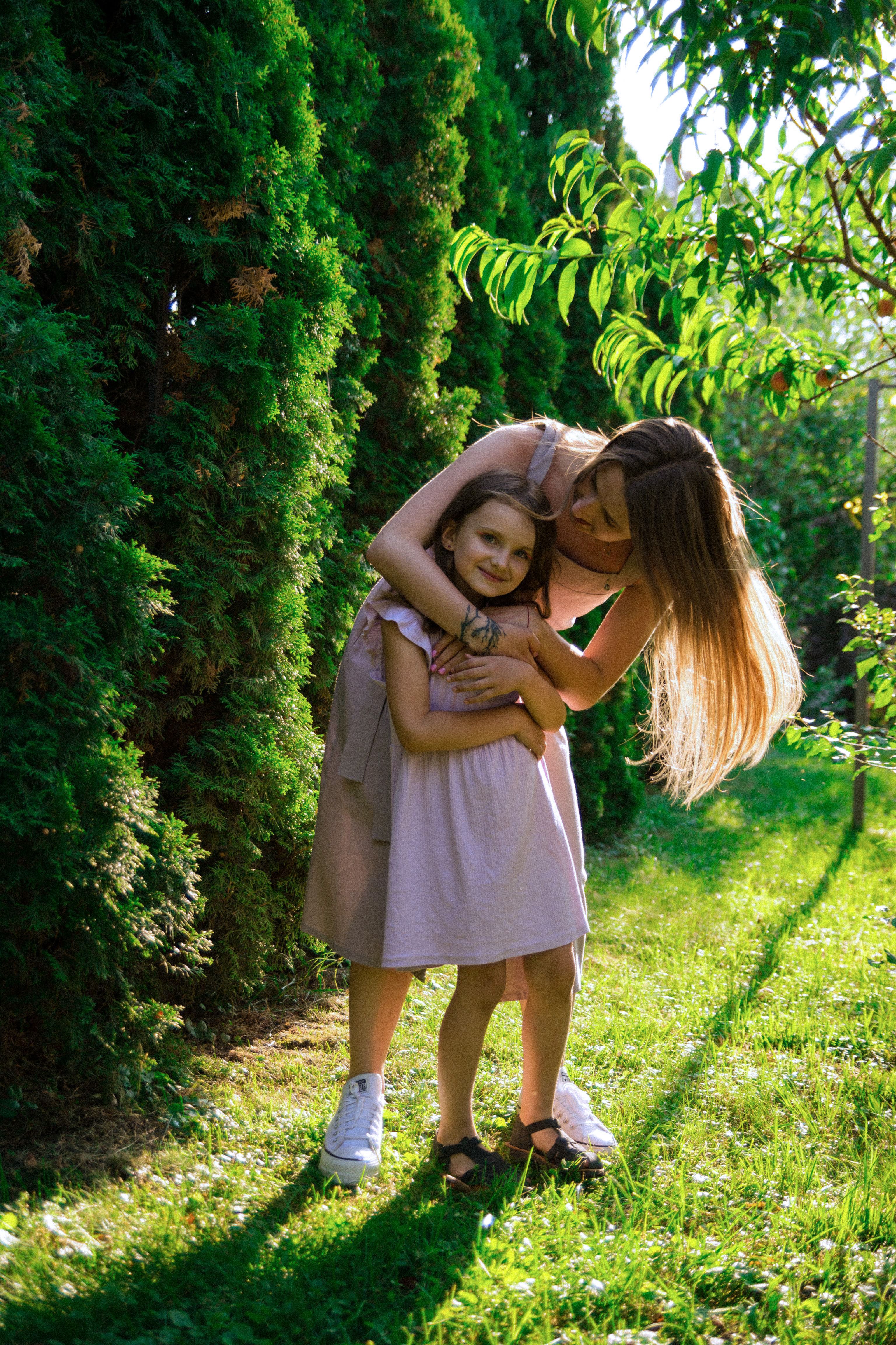 Woman Embracing her Daughter · Free Stock Photo