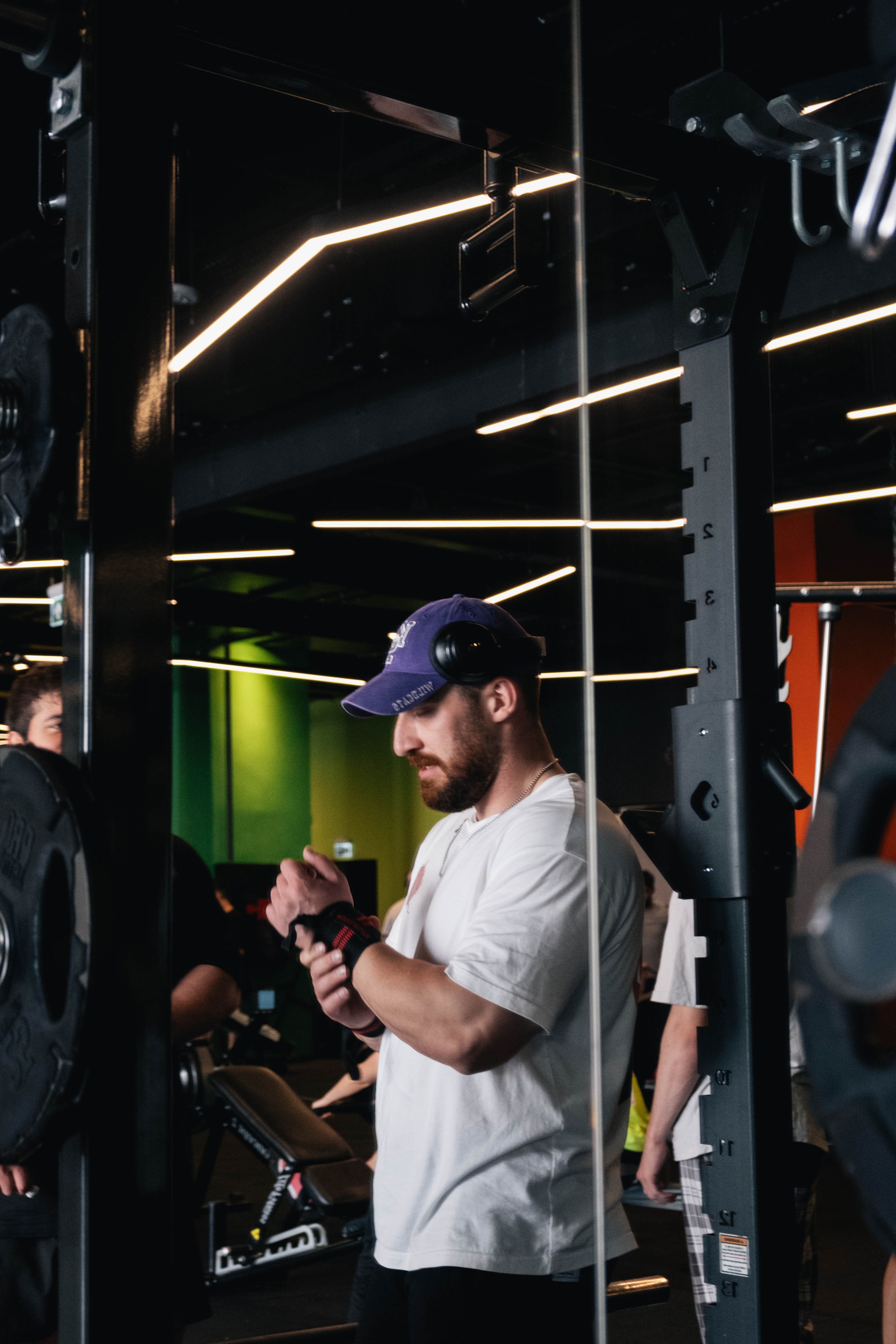A Muscular Man Flexing His Muscles at the Gym · Free Stock Photo
