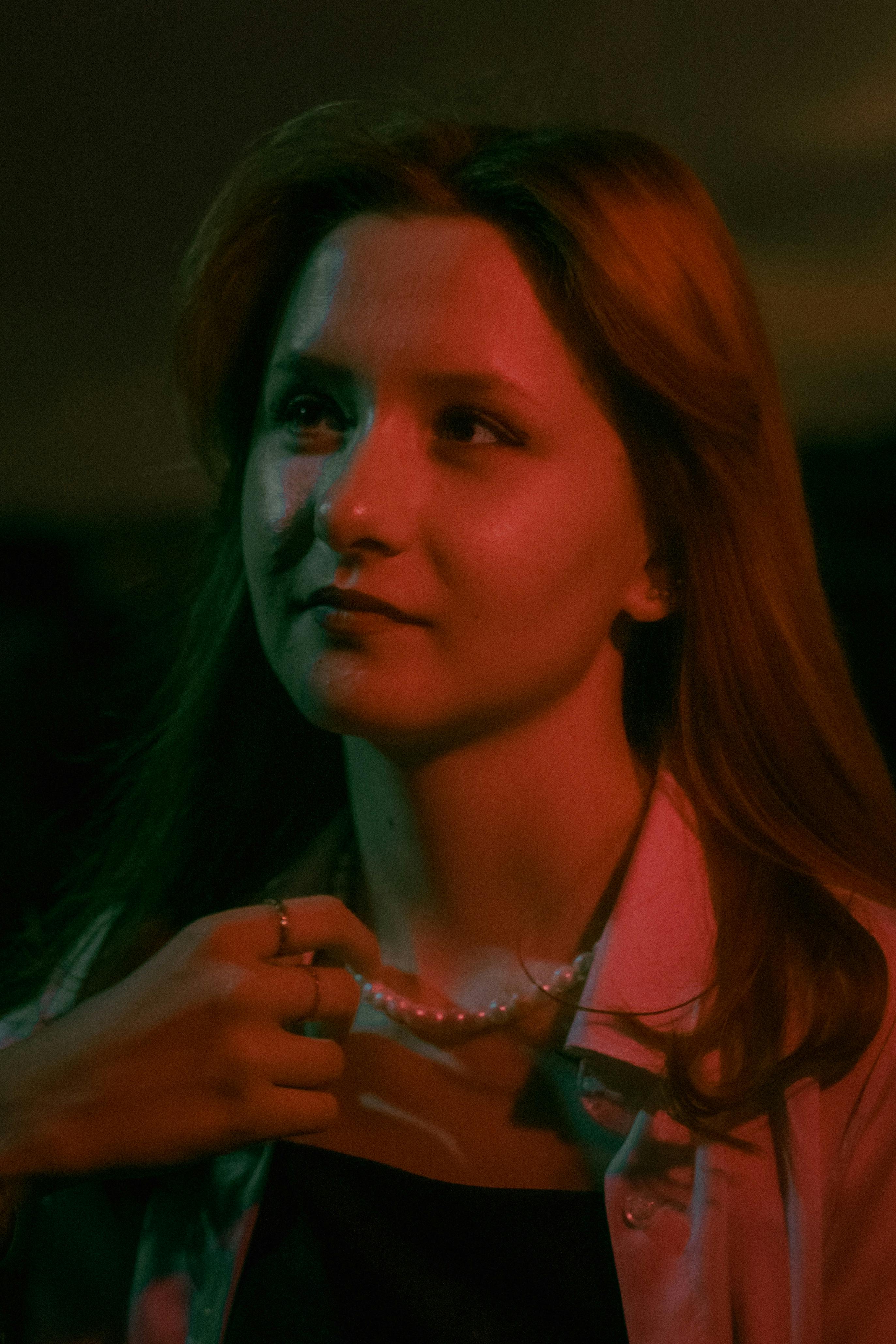 Studio Shot of a Woman in Red Lighting · Free Stock Photo