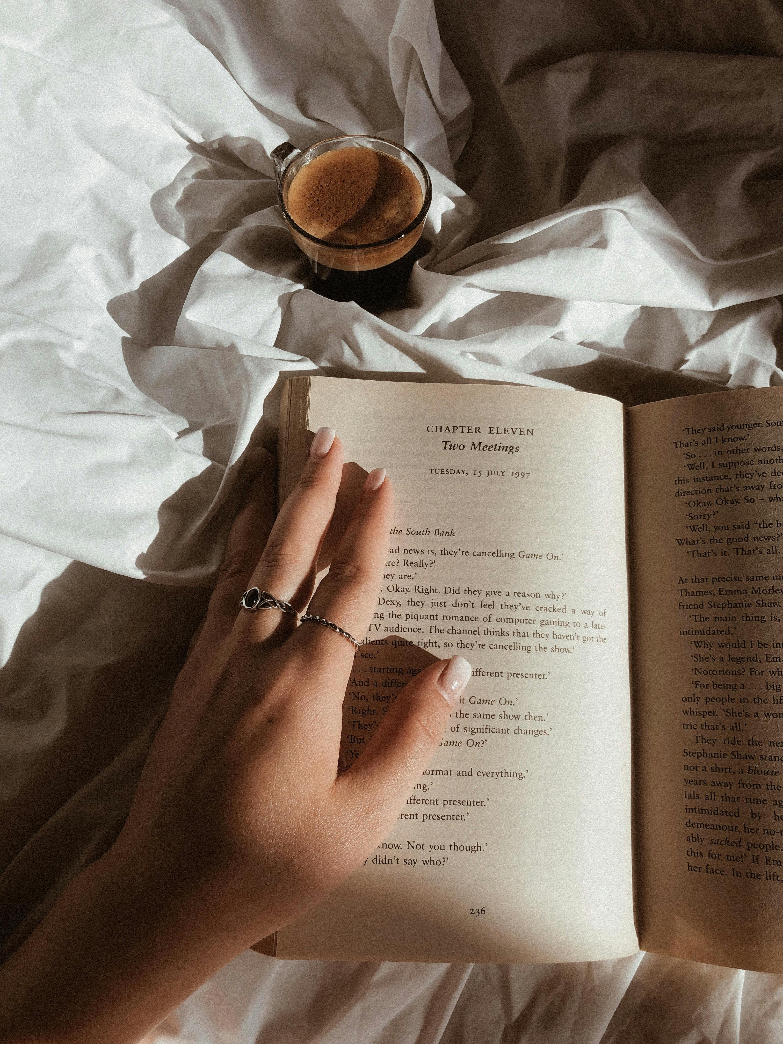 Hand Touching a Book · Free Stock Photo