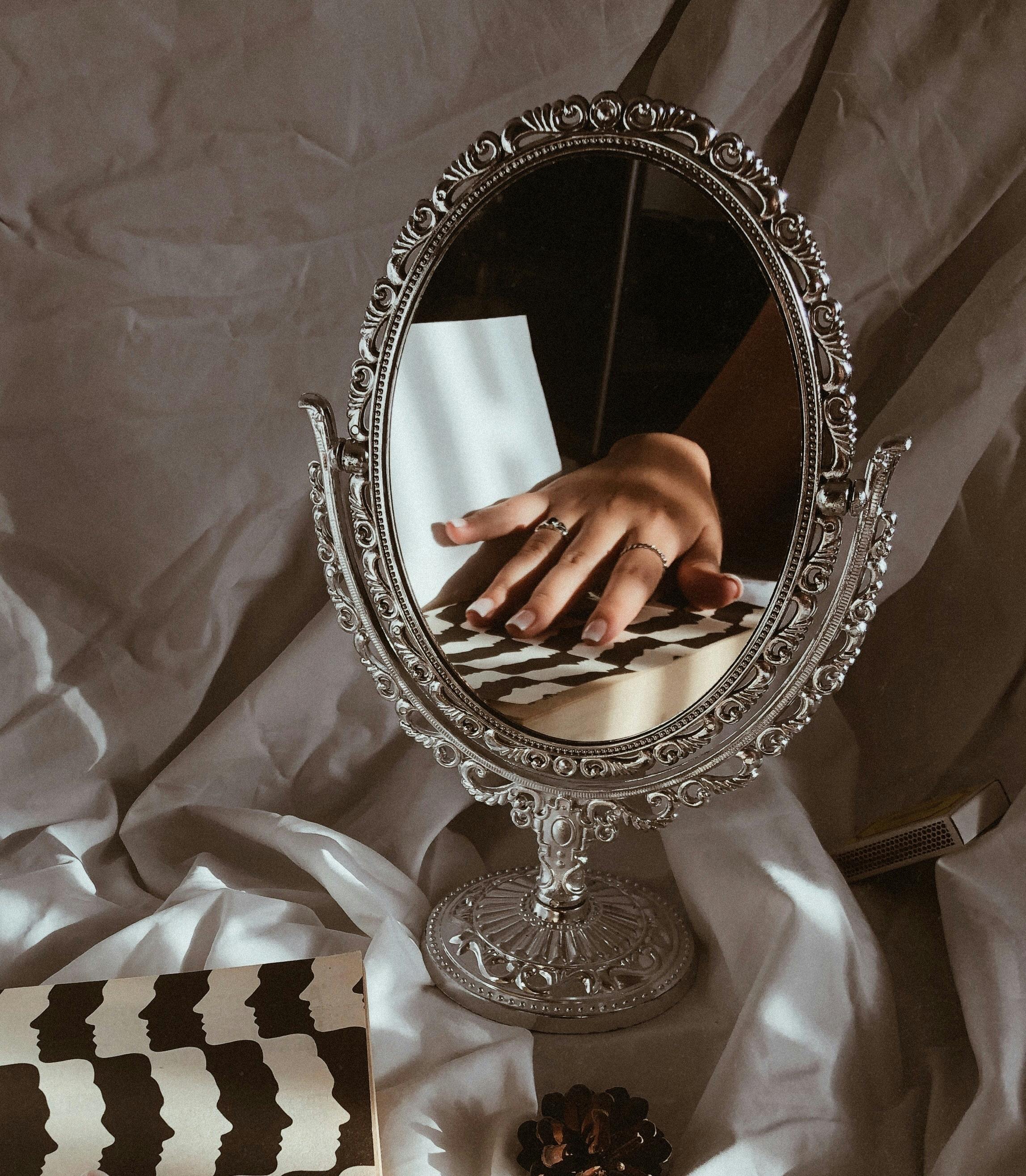 Woman Hand Reflection in Decorative Mirror · Free Stock Photo