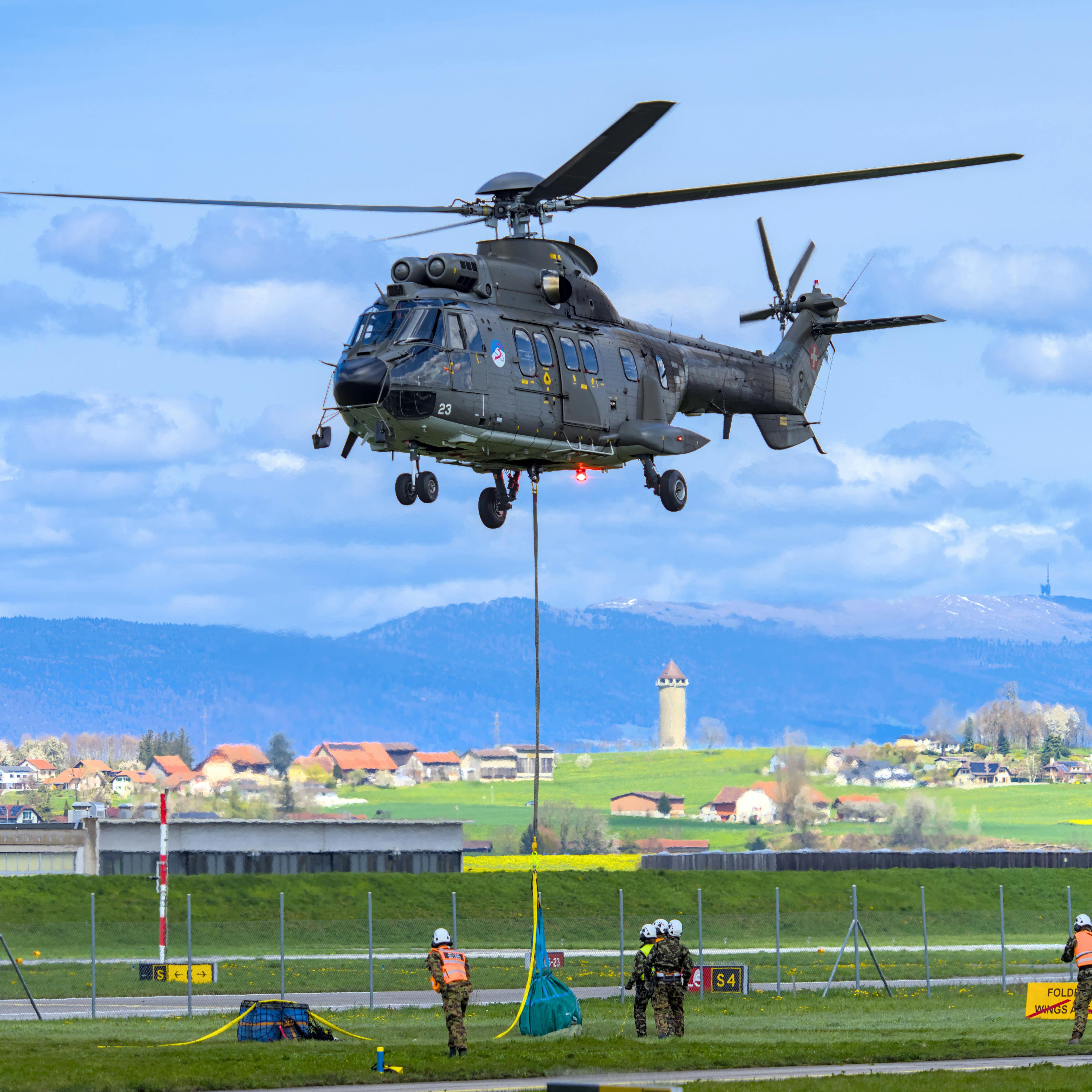 Helicopter Pulling Up Heavy Bags · Free Stock Photo