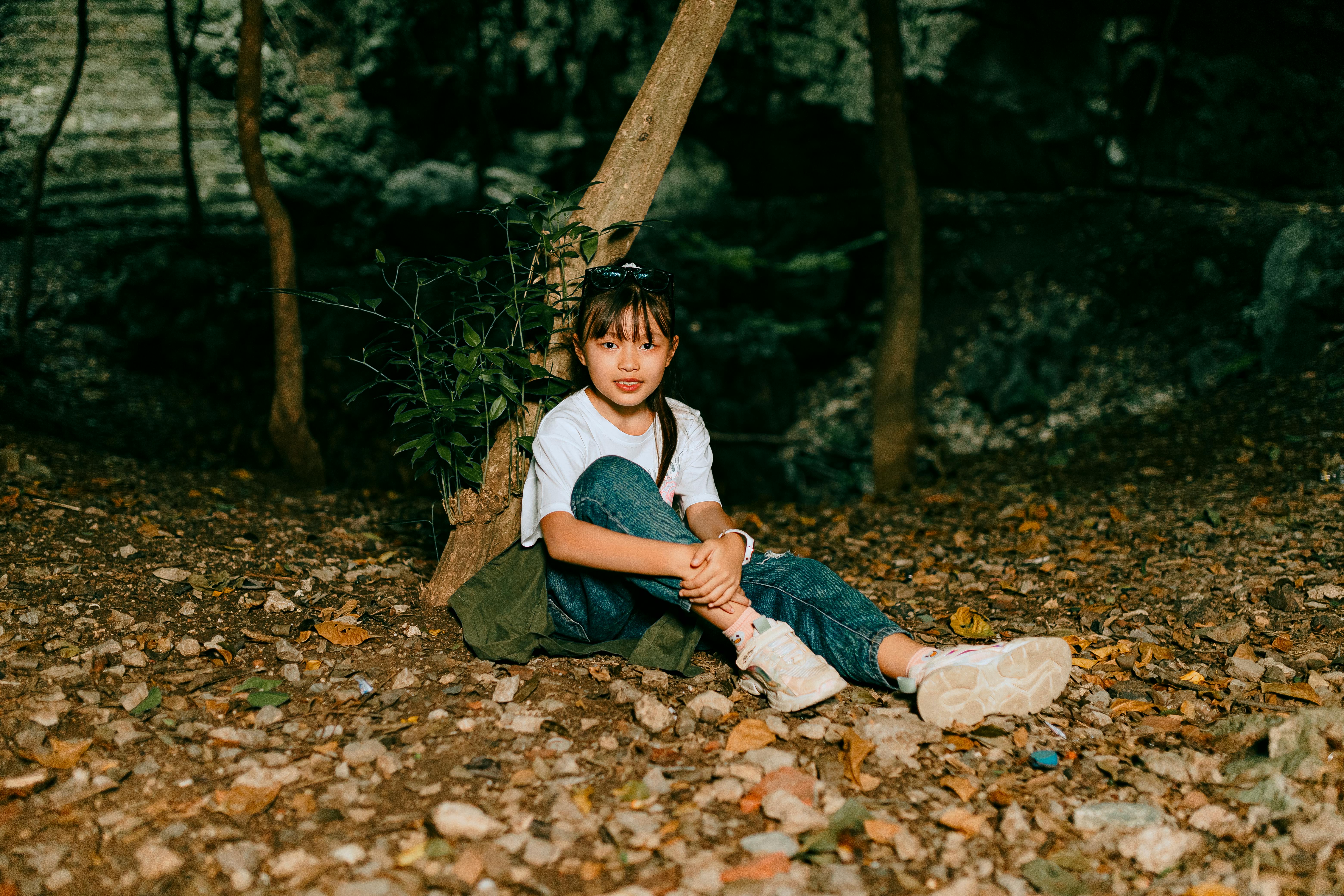 A Girl Sitting under a Tree and Smiling · Free Stock Photo
