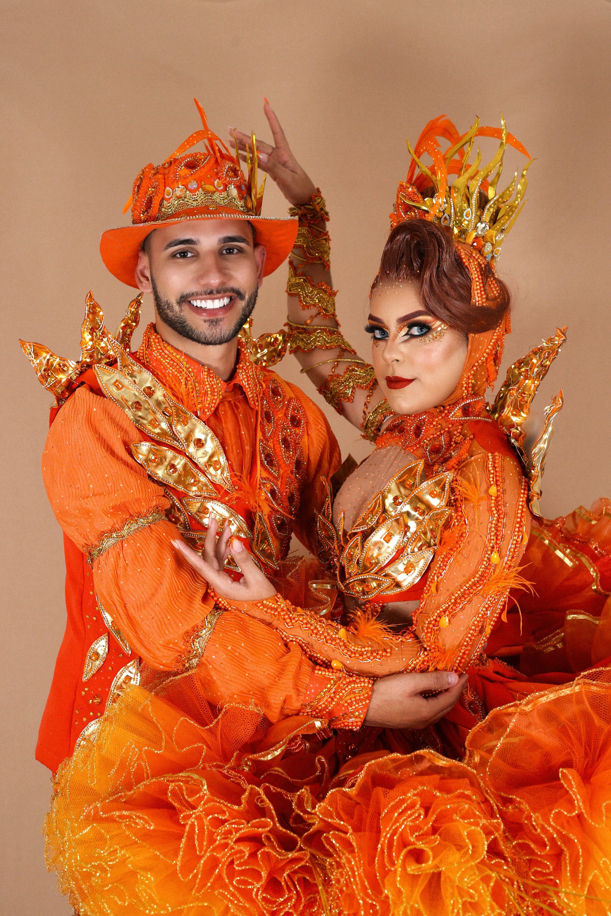 Couple in Orange Costumes · Free Stock Photo
