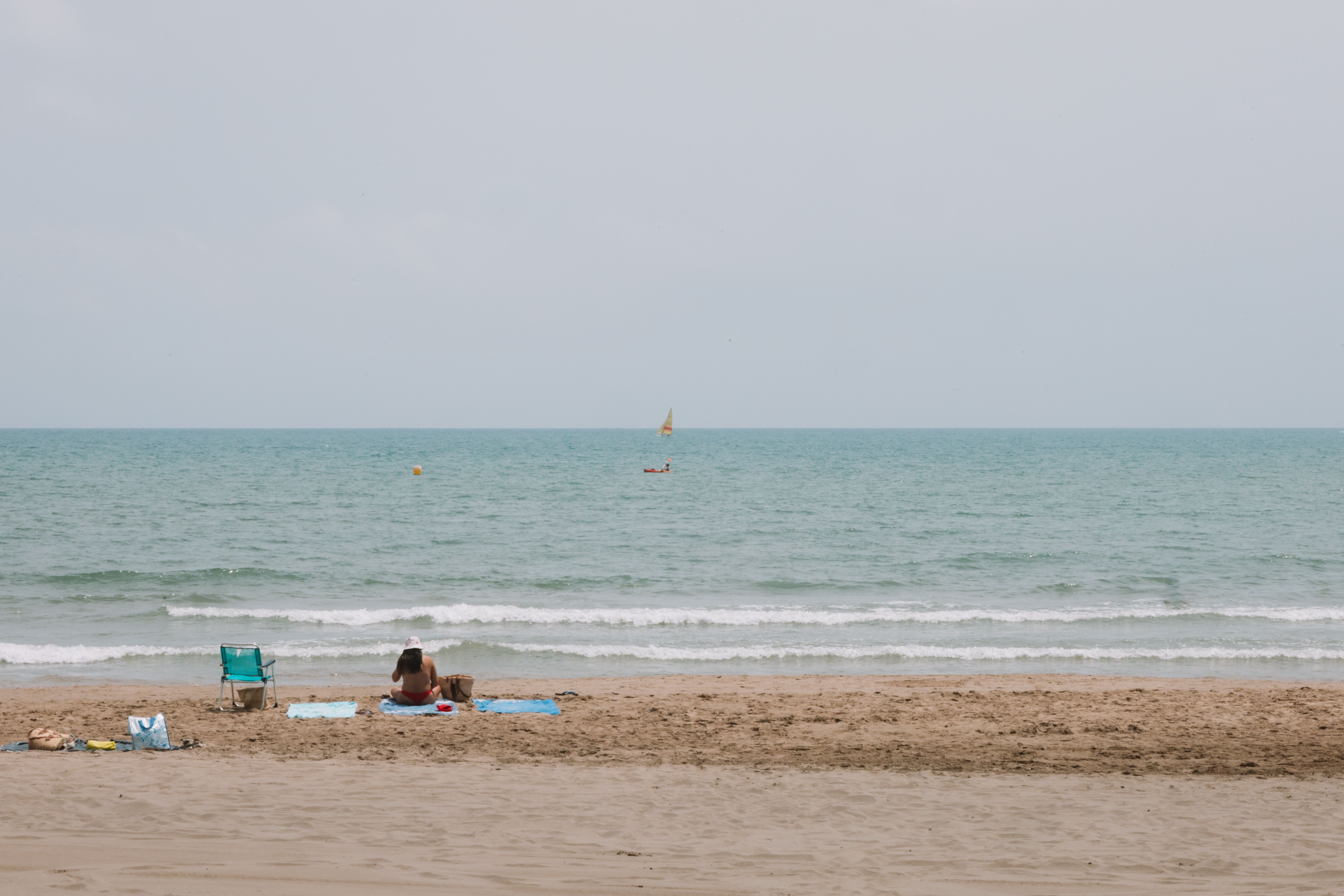 Tourist Sunbathing on the Beach · Free Stock Photo