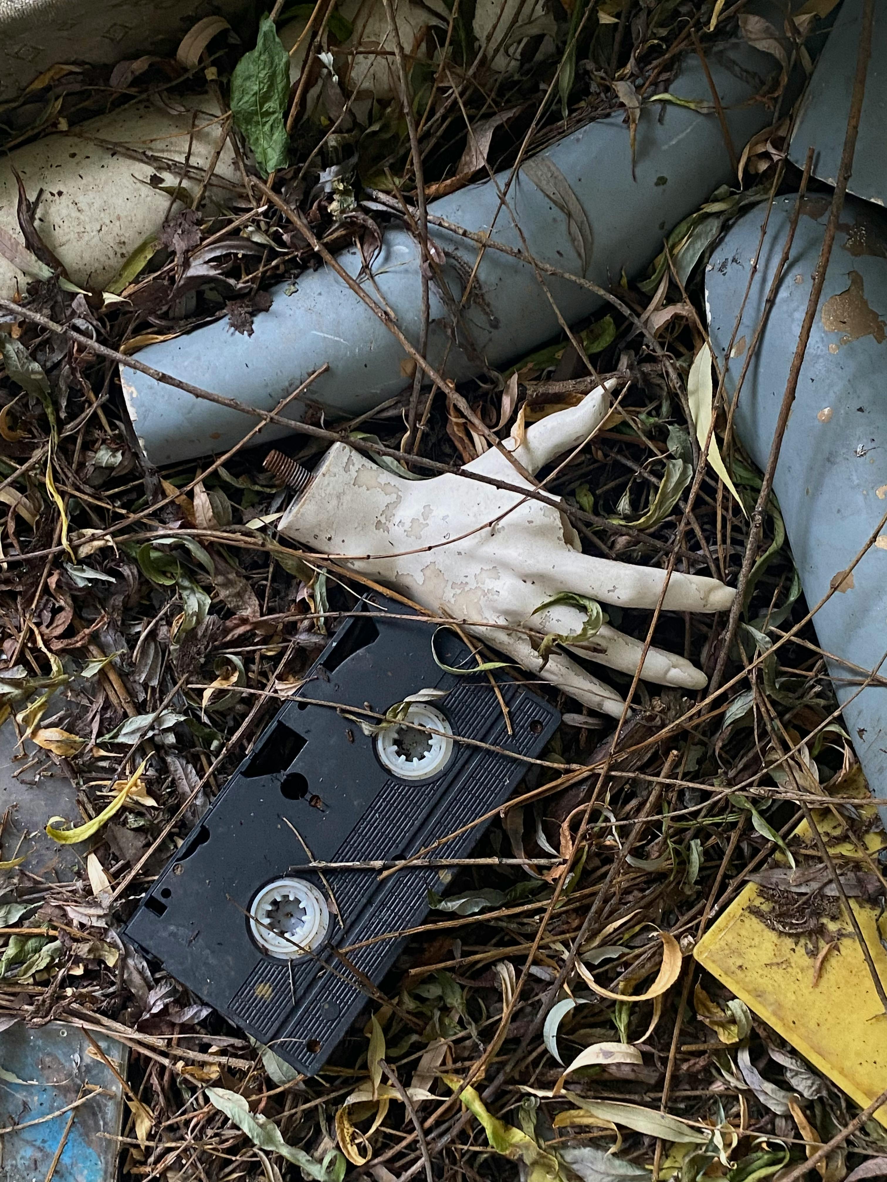 Close-up of a Cassette and a Mannequin Hand in a Pile of Junk · Free ...