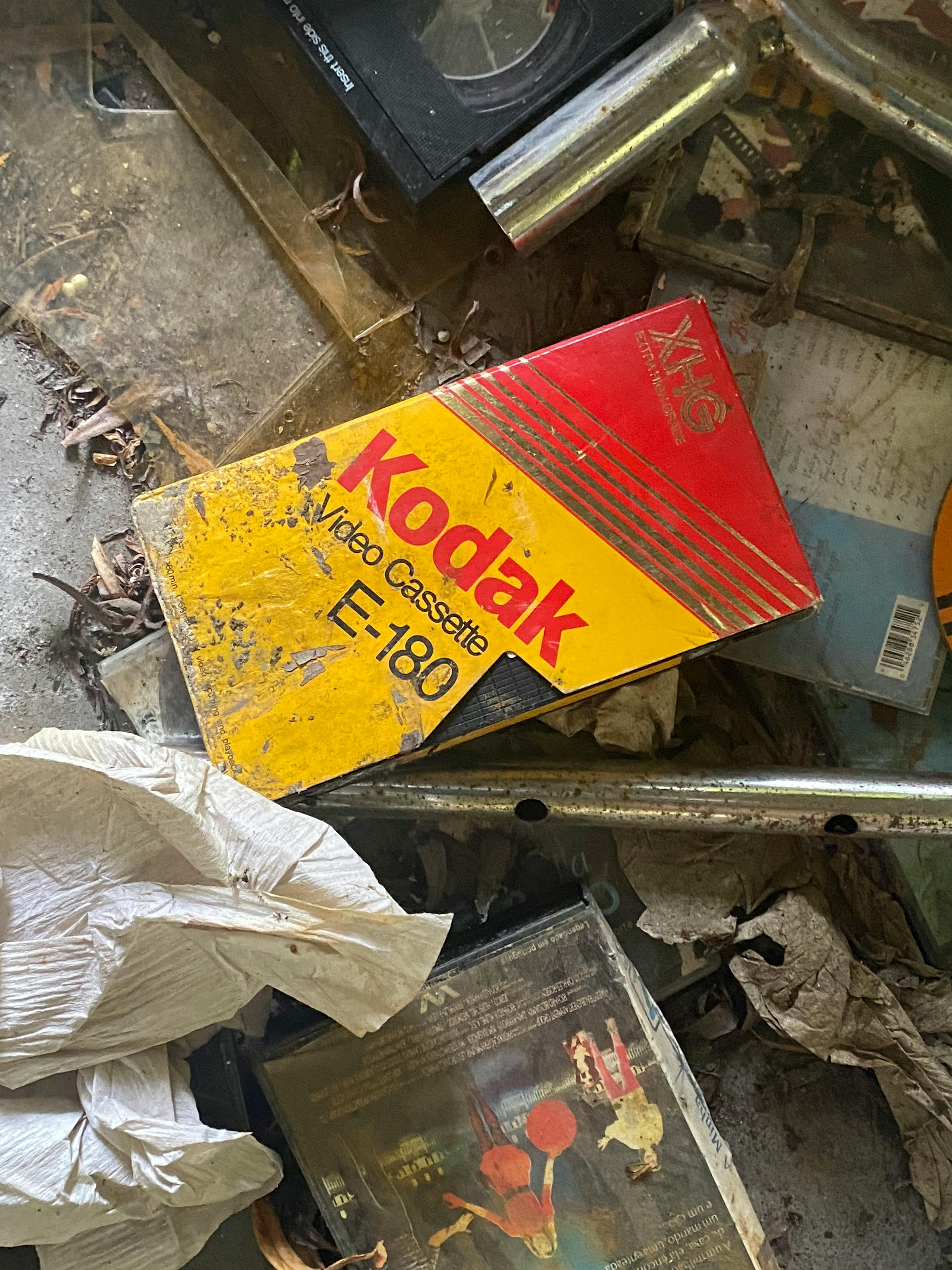 A Pile of Vintage Junk with a Kodak Video Cassette in the Middle · Free ...